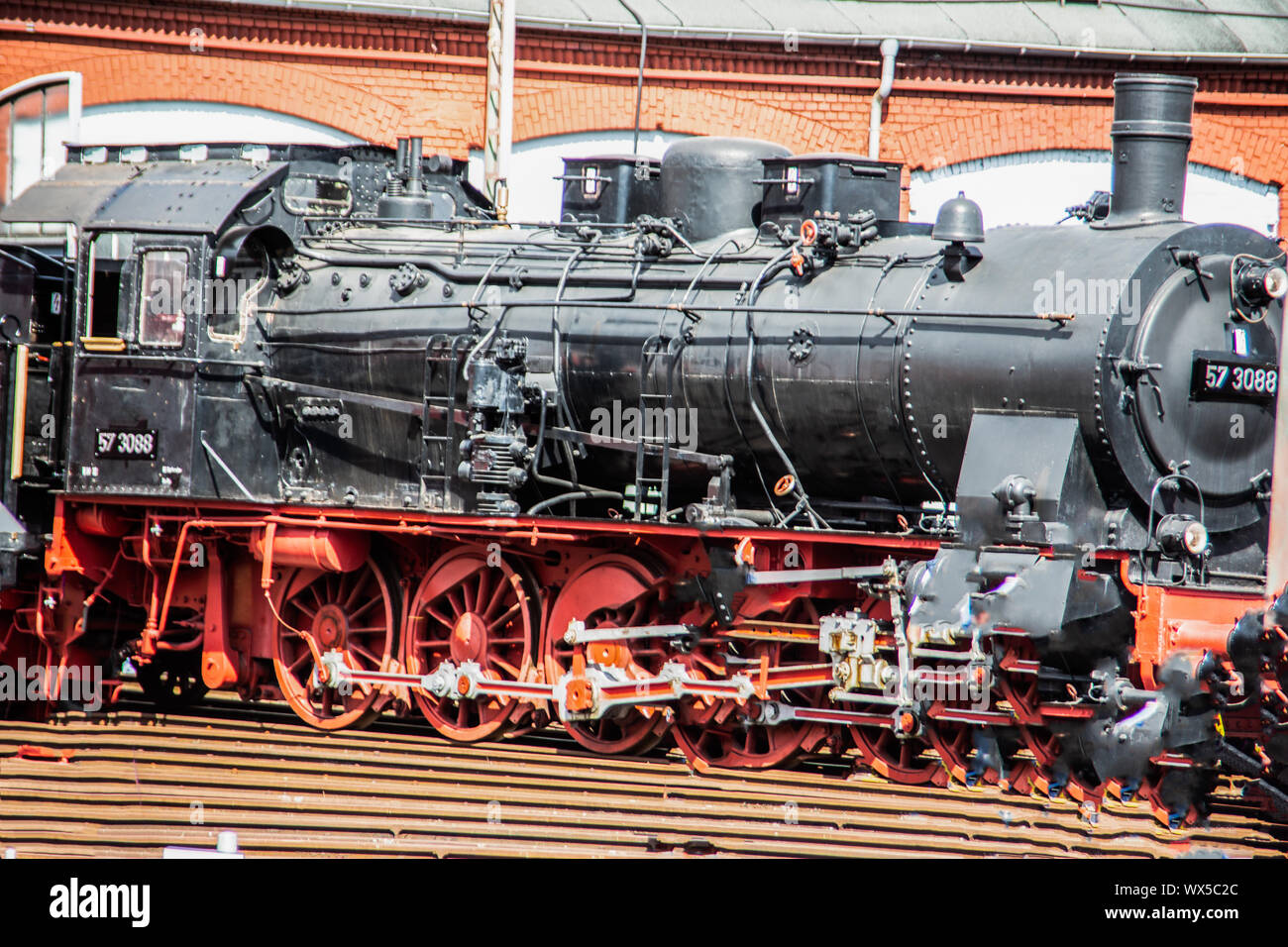 Engine shed with steam locomotive and tender Stock Photo - Alamy
