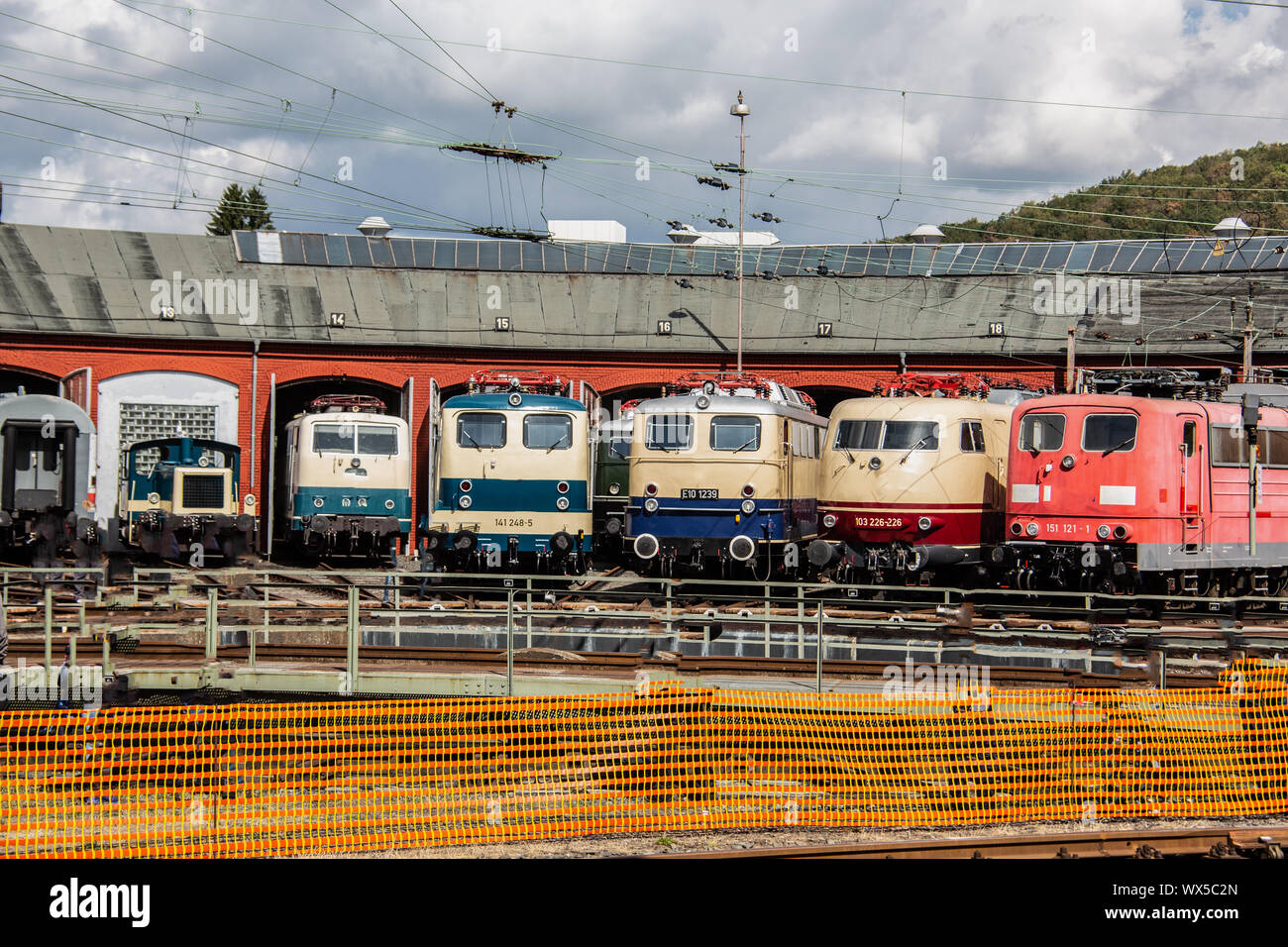 Engine shed with electric and diesel locomotives Stock Photo - Alamy
