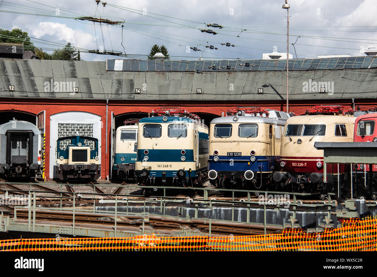 Engine shed with electric and diesel locomotives Stock Photo - Alamy