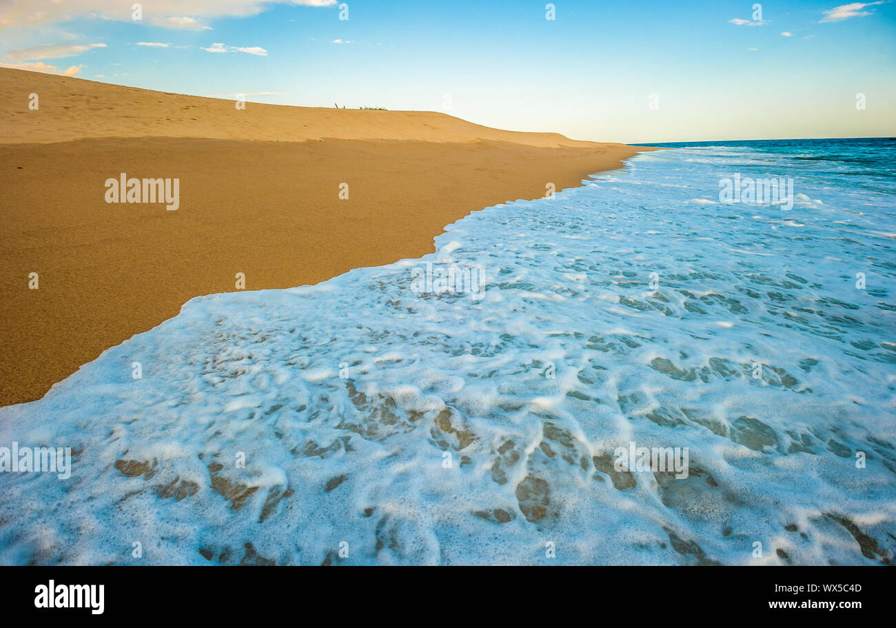 Yellow sand beach, sea and deep blue sky Stock Photo - Alamy