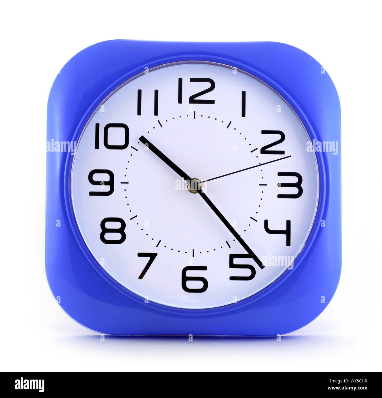 Small blue alarm clock isolated on white background Stock Photo - Alamy