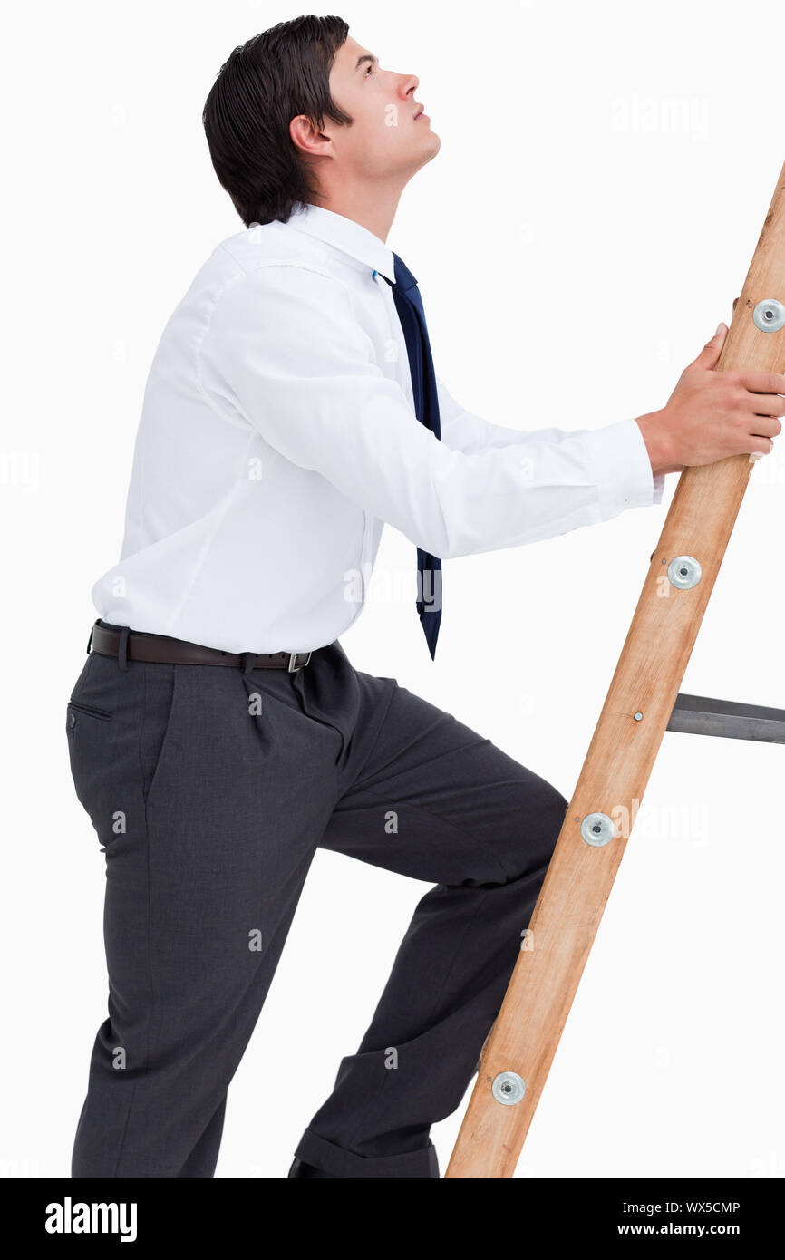 Man climbing a ladder looking up hi-res stock photography and images ...