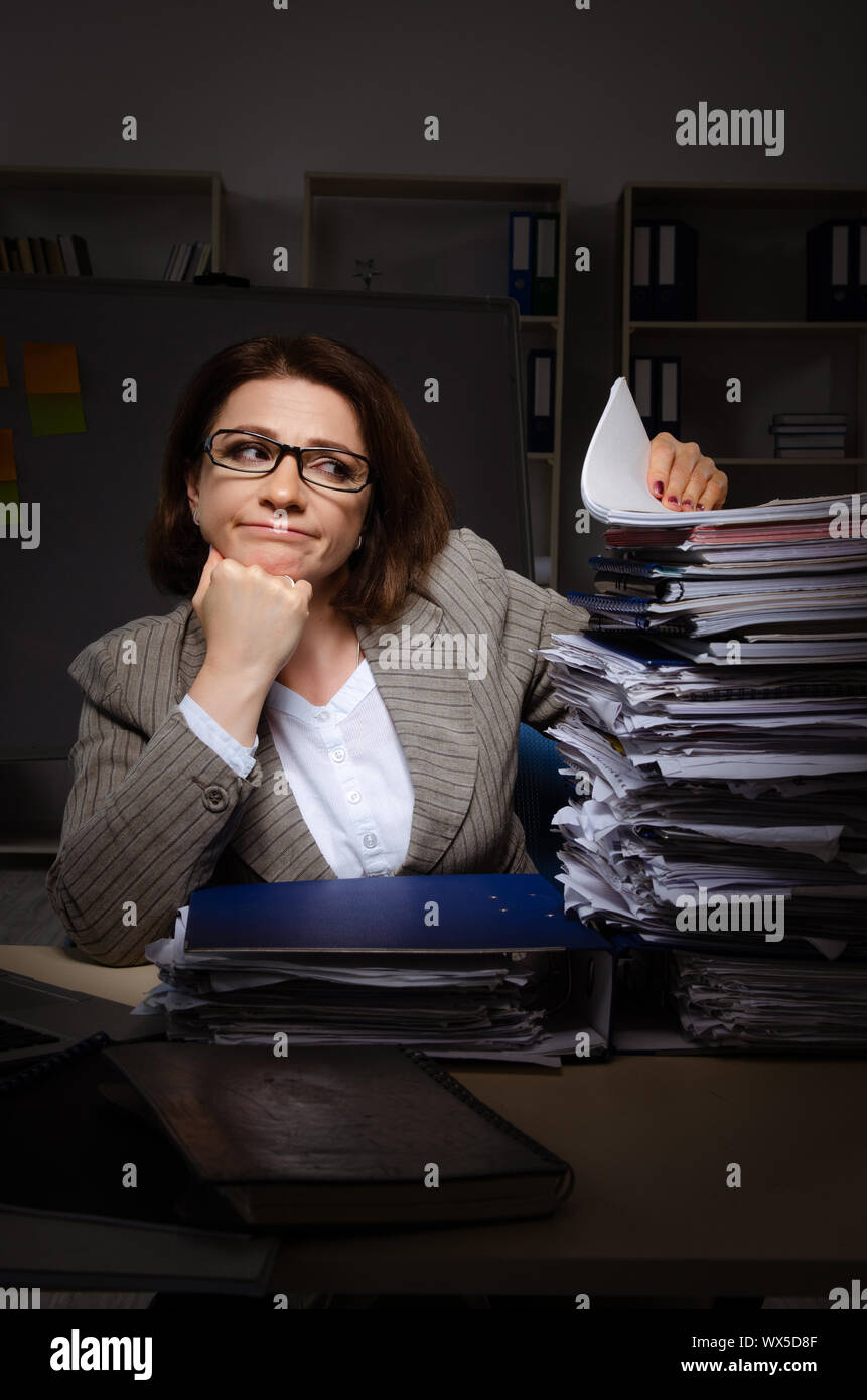 Female employee suffering from excessive work Stock Photo - Alamy