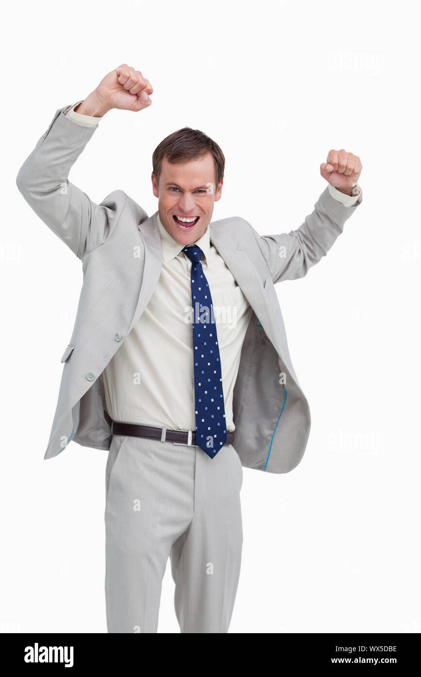 Cheering businessman with his arms up against a white background Stock ...