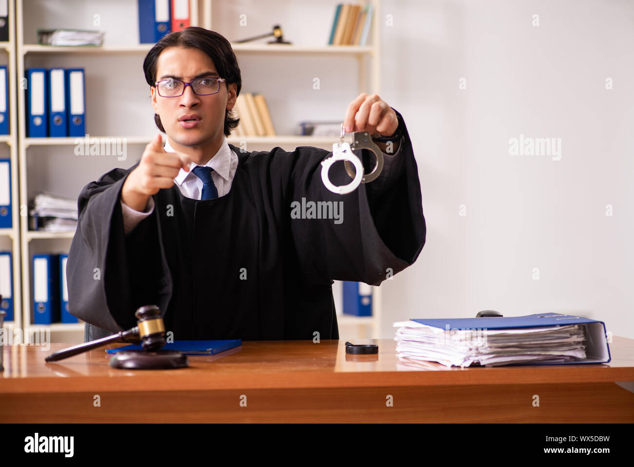 Young handsome judge working in court Stock Photo - Alamy