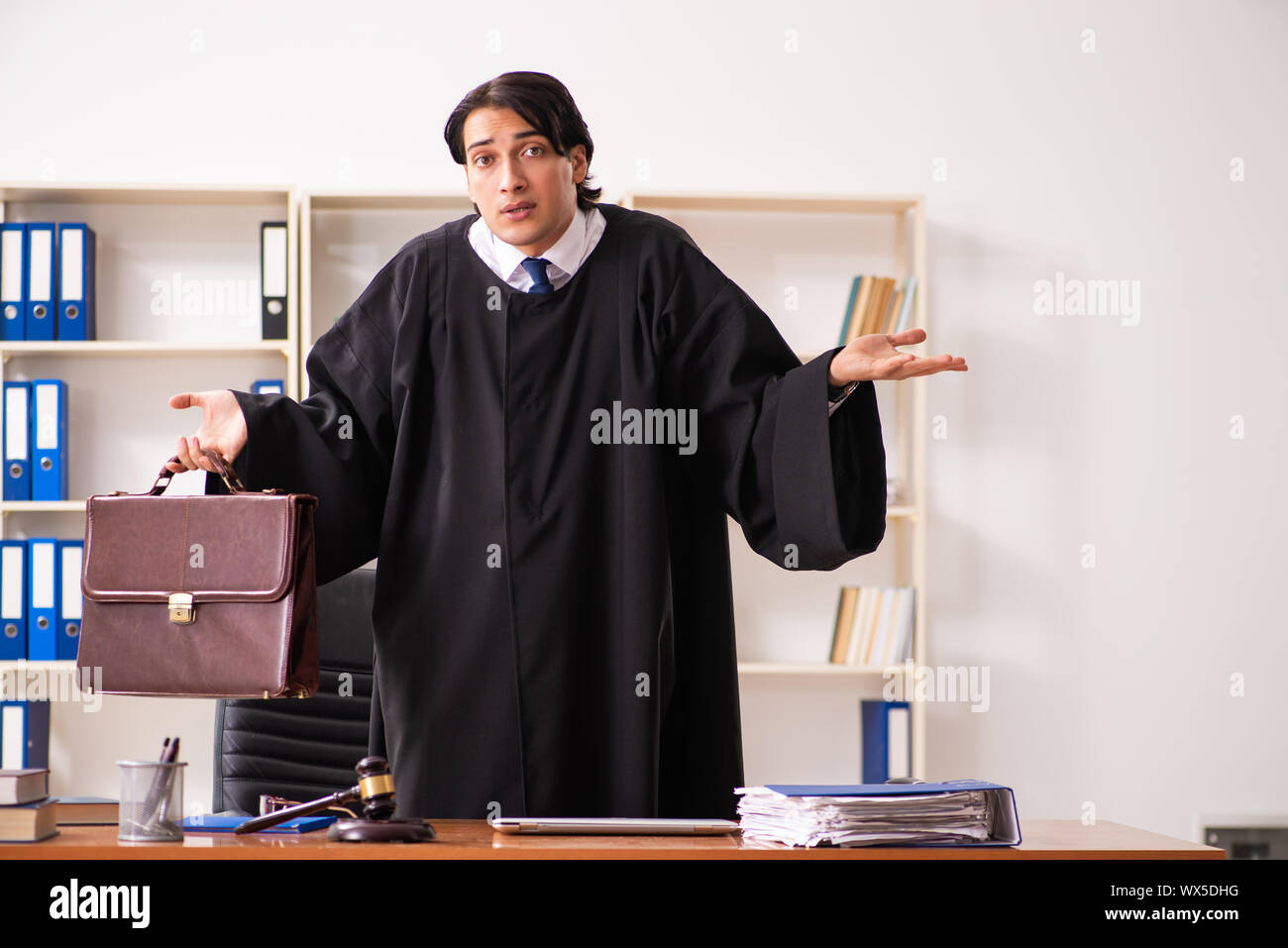 Young handsome judge working in court Stock Photo - Alamy