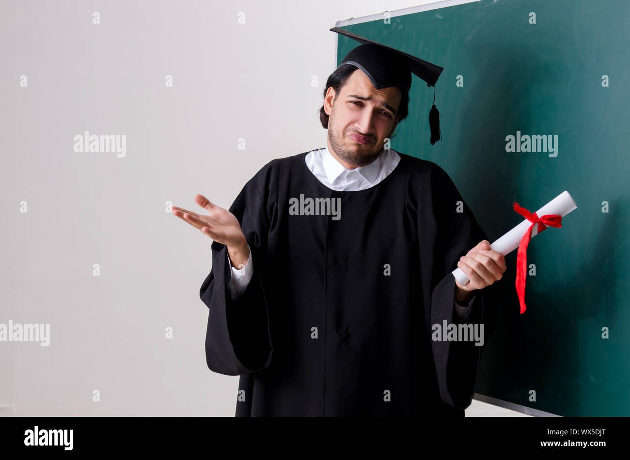 Sad graduate student diploma hi-res stock photography and images - Alamy