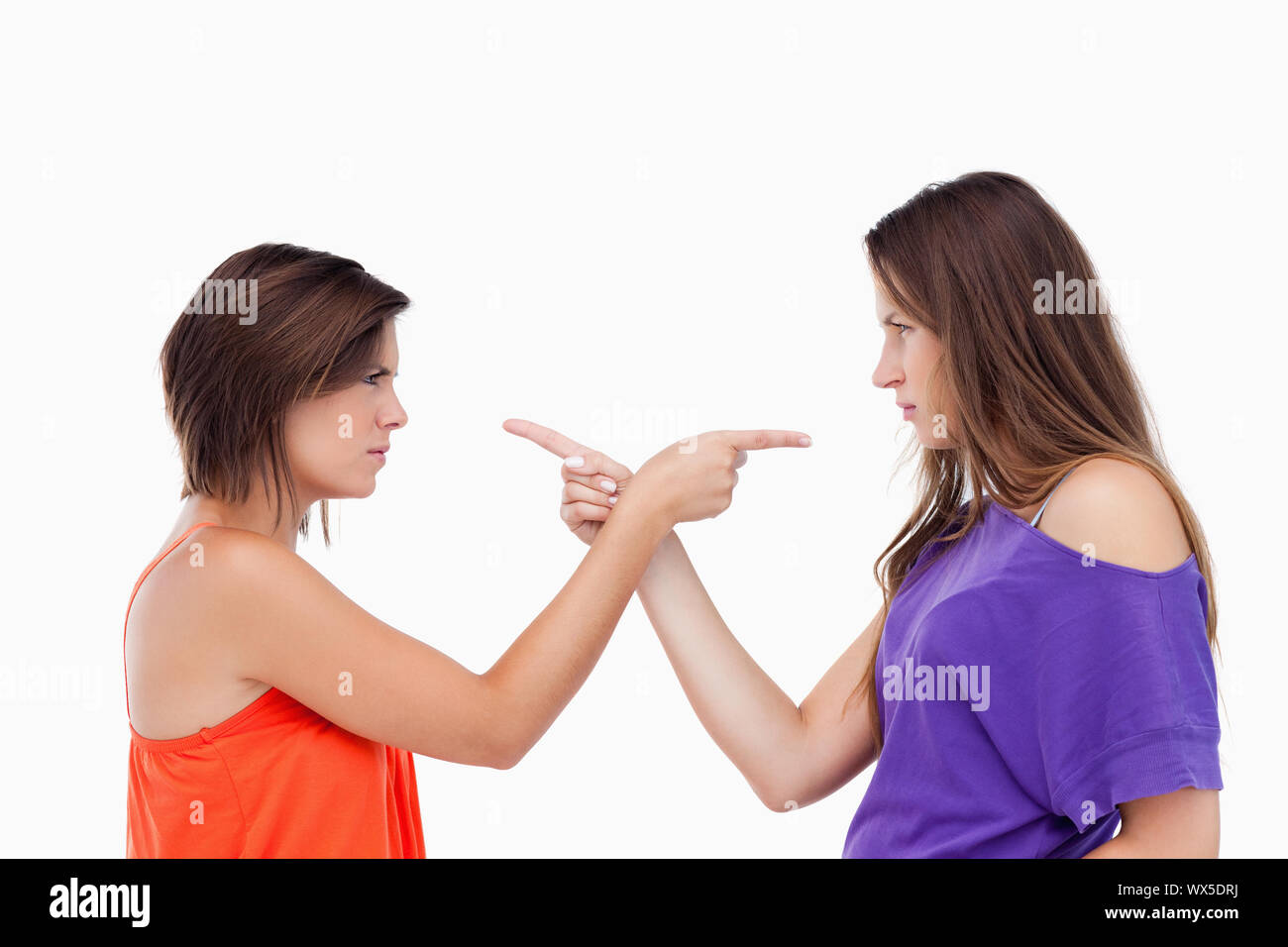 Two teenagers blaming each other while pointing their fingers Stock ...