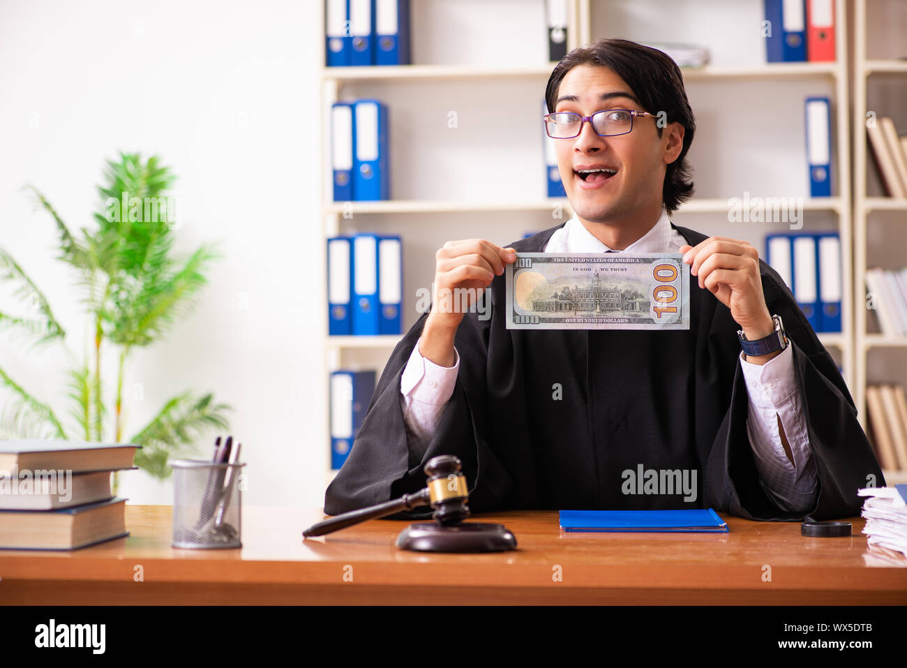 Young handsome judge working in court Stock Photo - Alamy