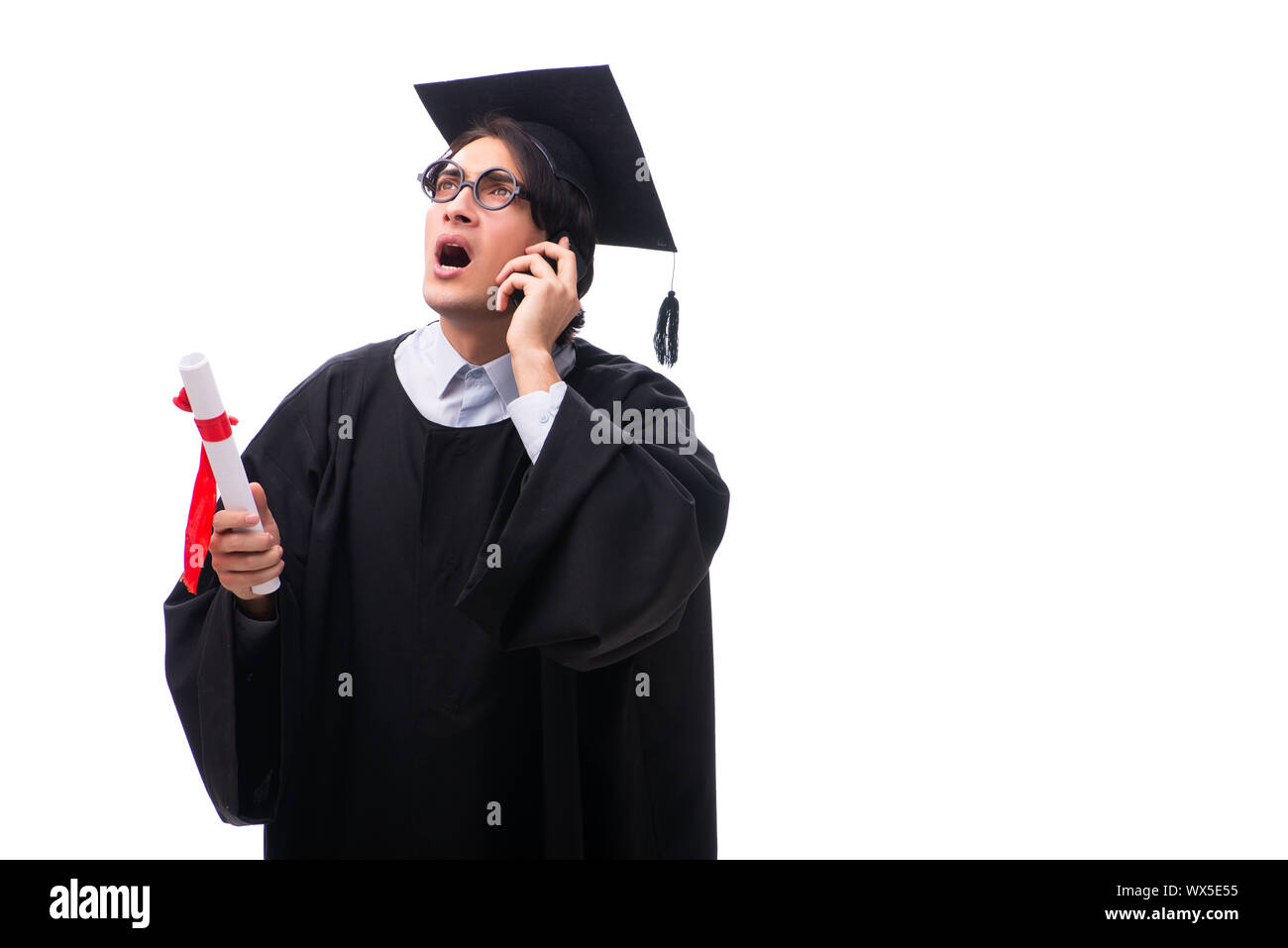 Young handsome man graduating from university Stock Photo - Alamy