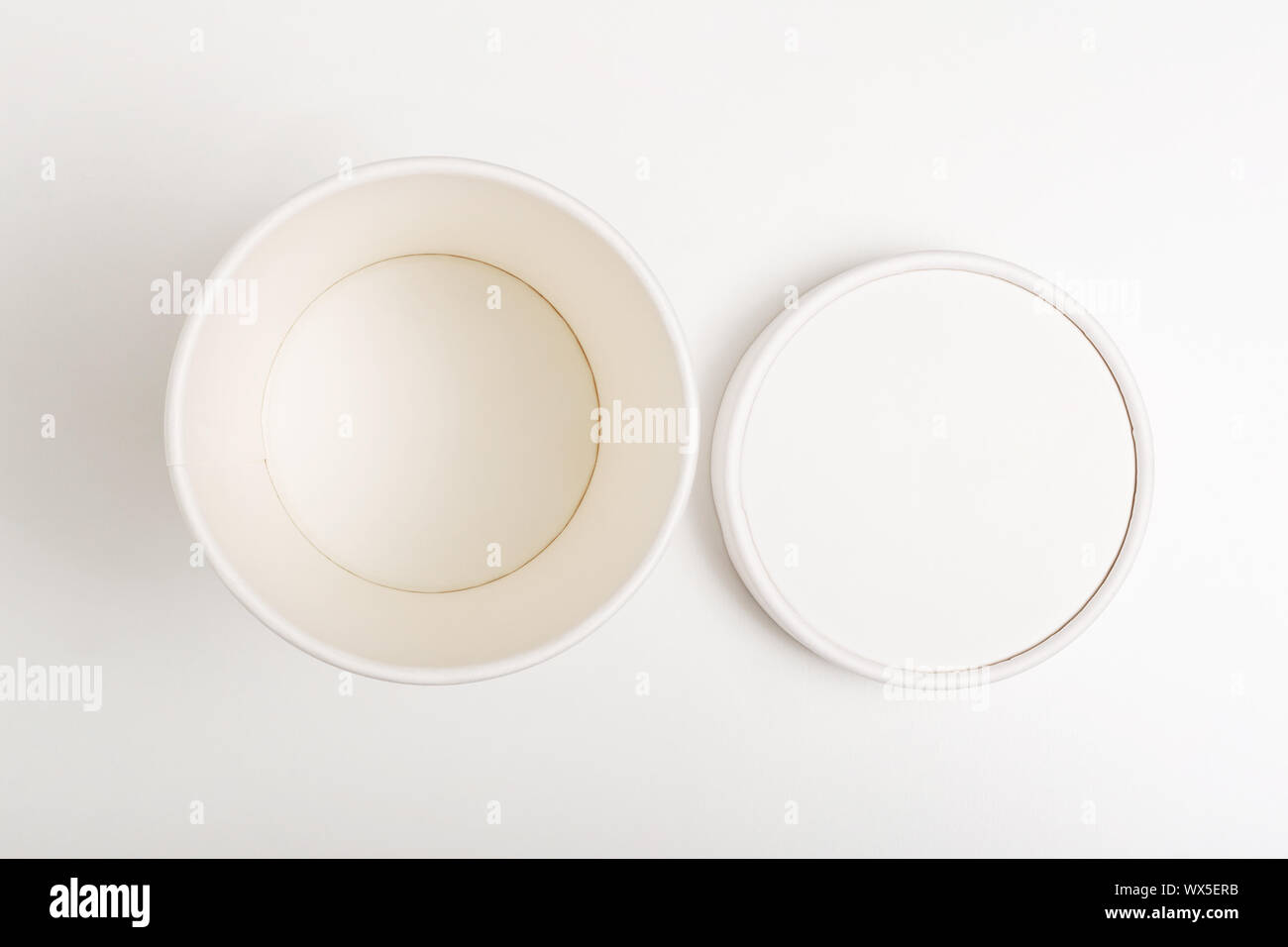 White paper cup with lid mockup on white background. Flat lay. Top view ...