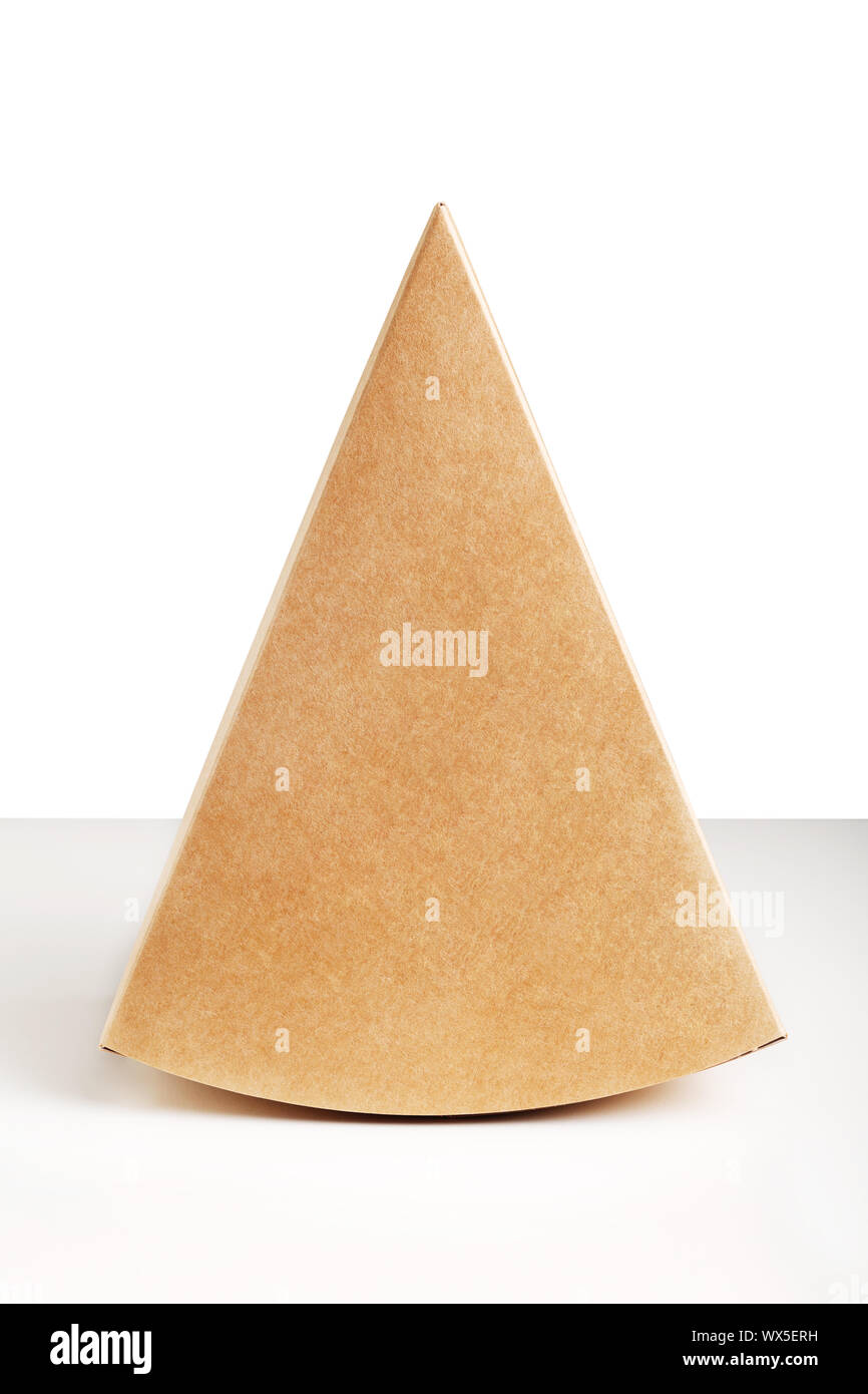 Triangle carton paper box on table on white background Stock Photo - Alamy