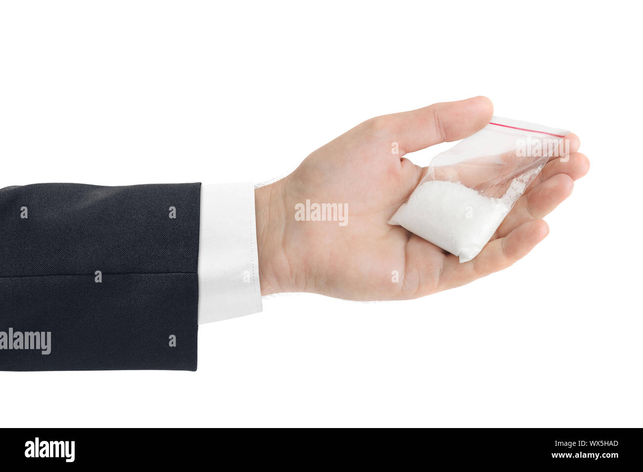 Hand and packet with narcotic Stock Photo - Alamy