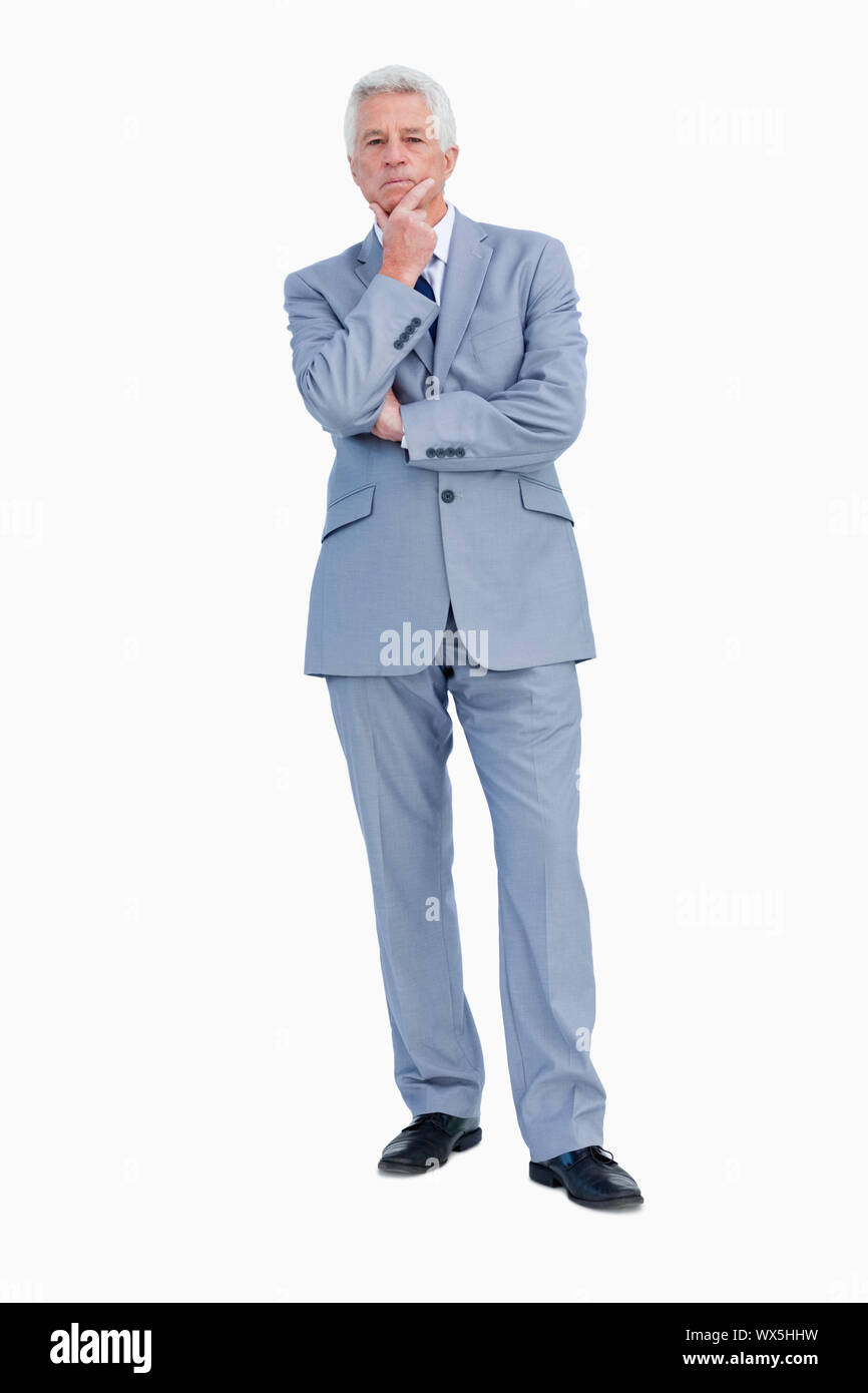 Portrait of a businessman hesitating against white background Stock ...