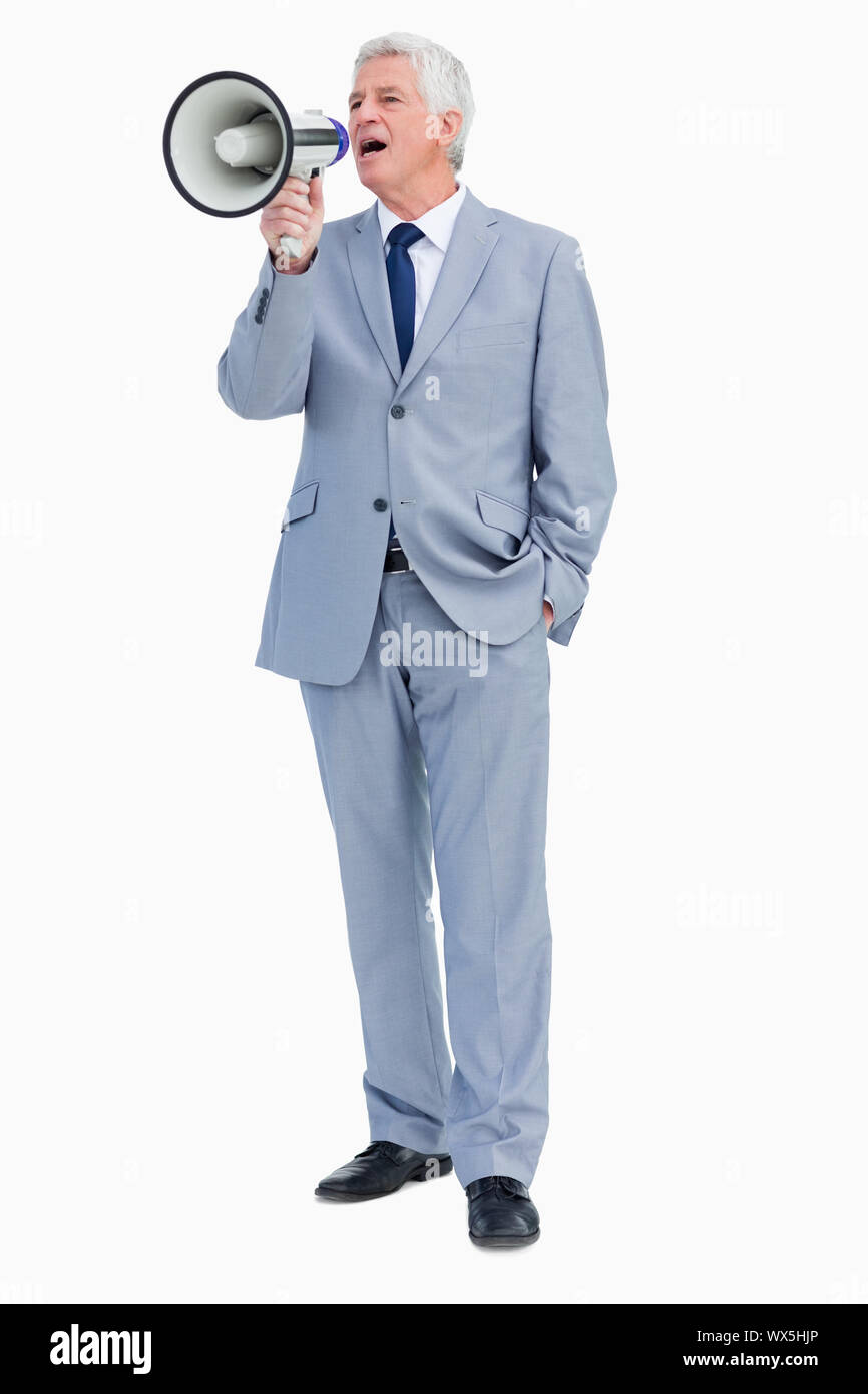 Businessman shouting with megaphone against white background Stock ...