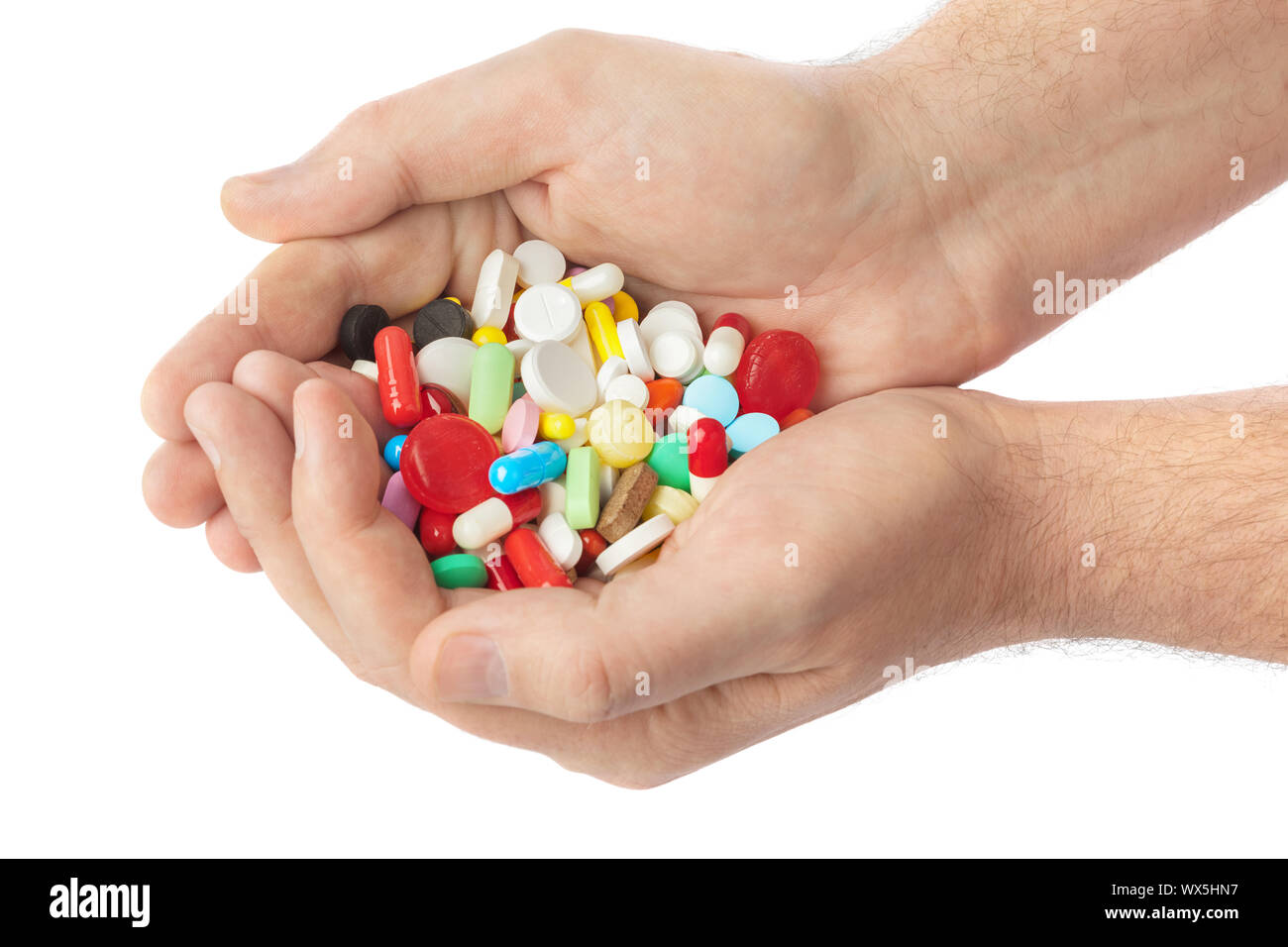 Hand holding stack of tablets hi-res stock photography and images - Alamy