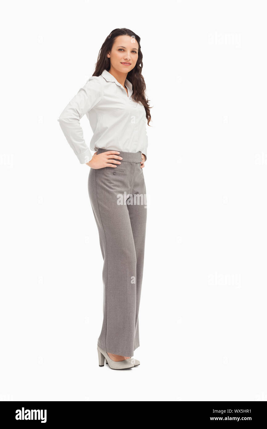 Portrait of an employee arms on hips against white background Stock ...