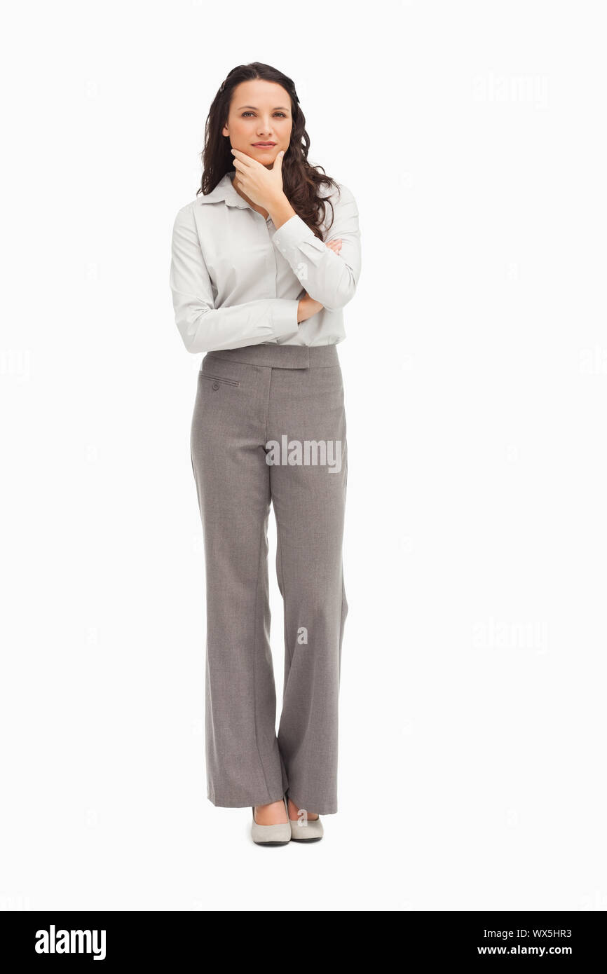 Portrait of a thoughtful pretty employee against white background Stock ...