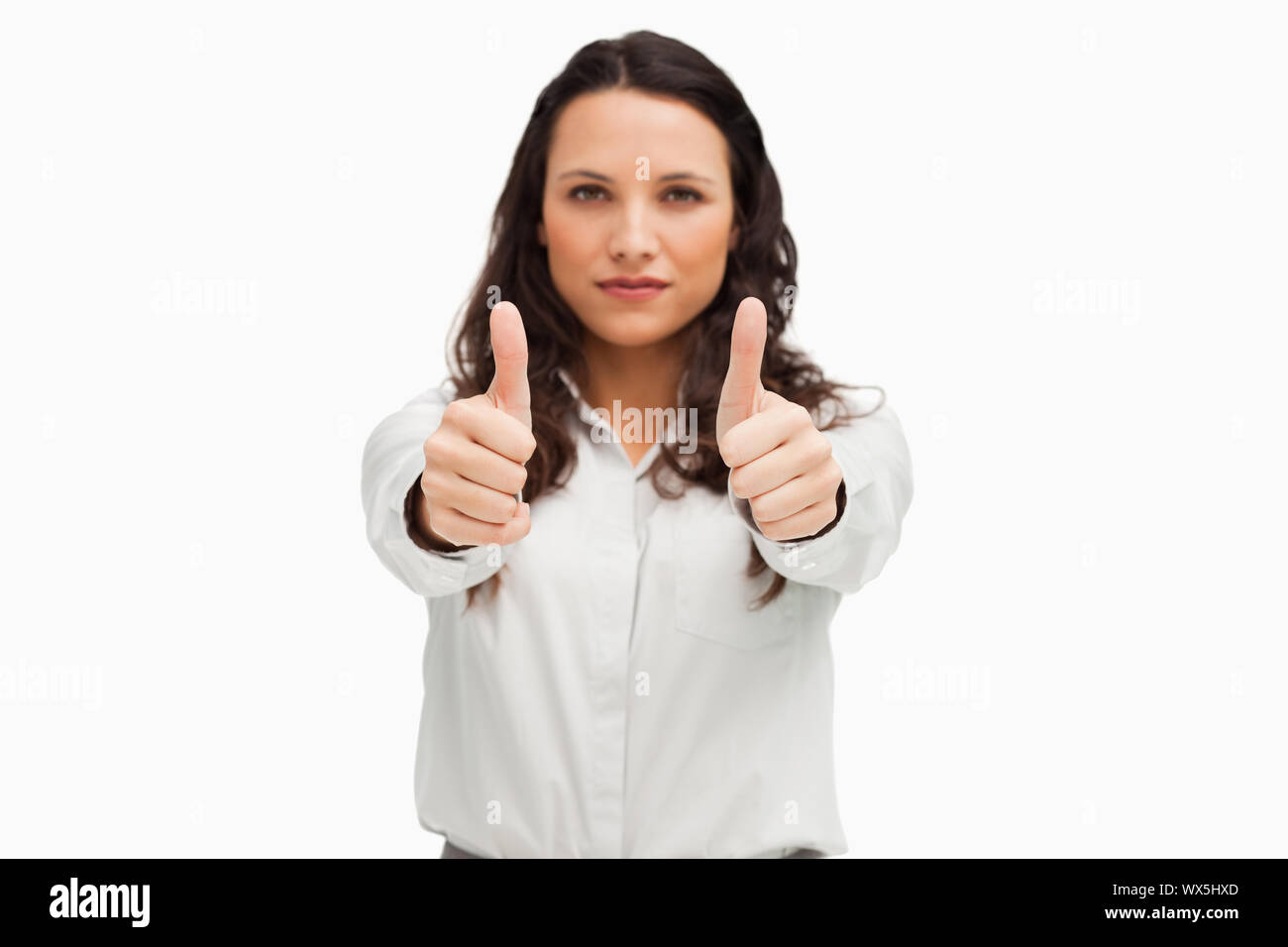 Portrait of a brunette approving against white background Stock Photo ...