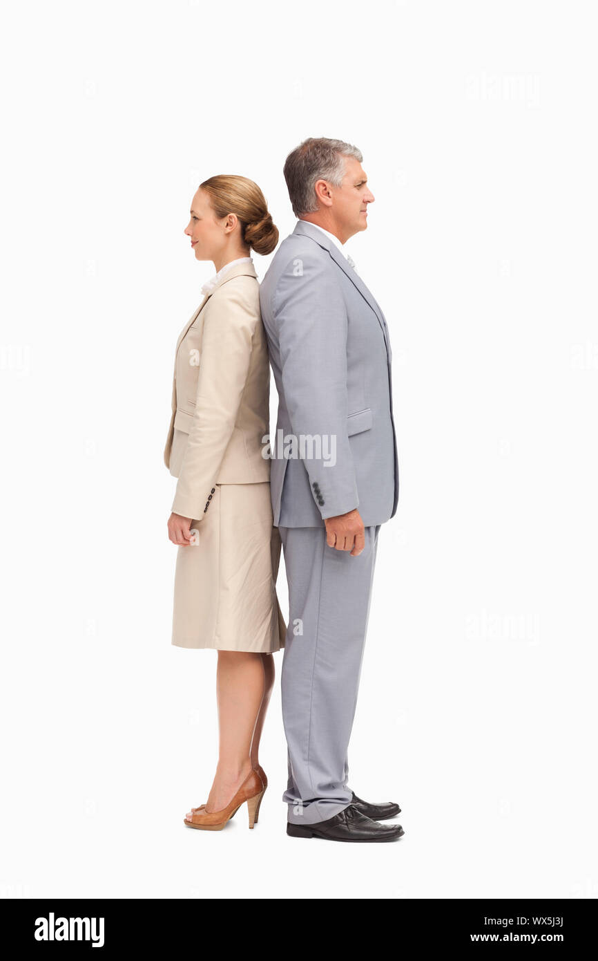 Business people back to back against white background Stock Photo - Alamy