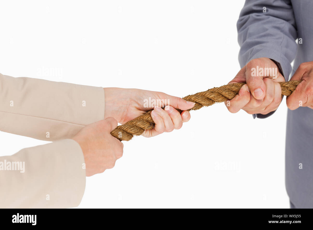 Business people pulling the rope against white background Stock Photo ...