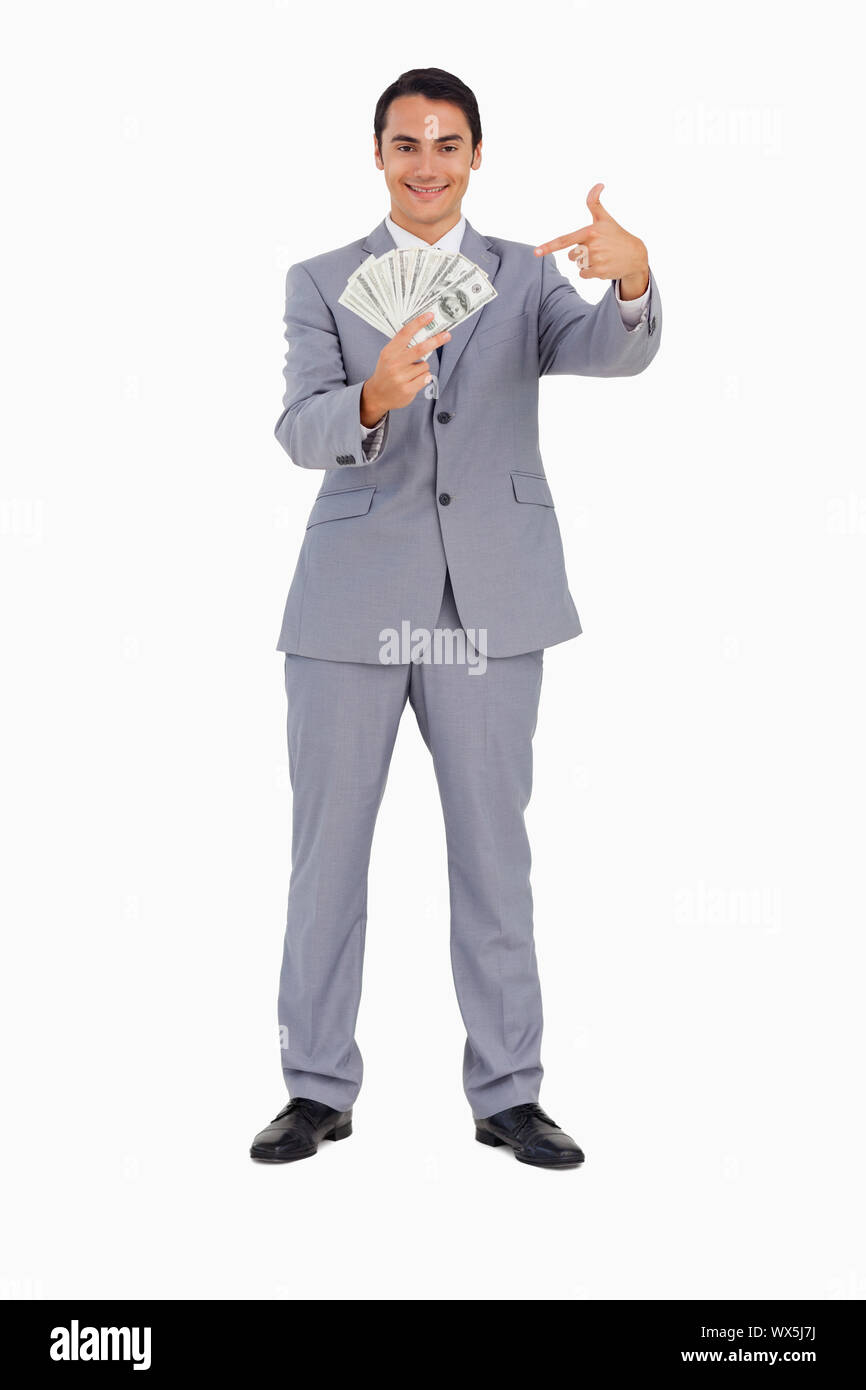 Portrait of a good-looking man showing a lot of dollars against white ...