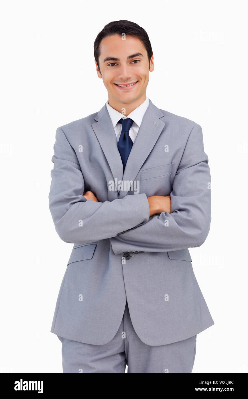 Close-up of a good-looking man with folded arms against white background Stock Photo - Alamy