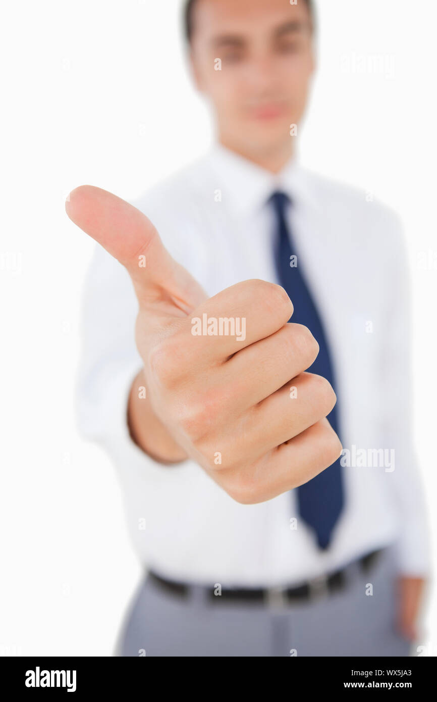 Close-up of a man the thumb-up against white background Stock Photo - Alamy