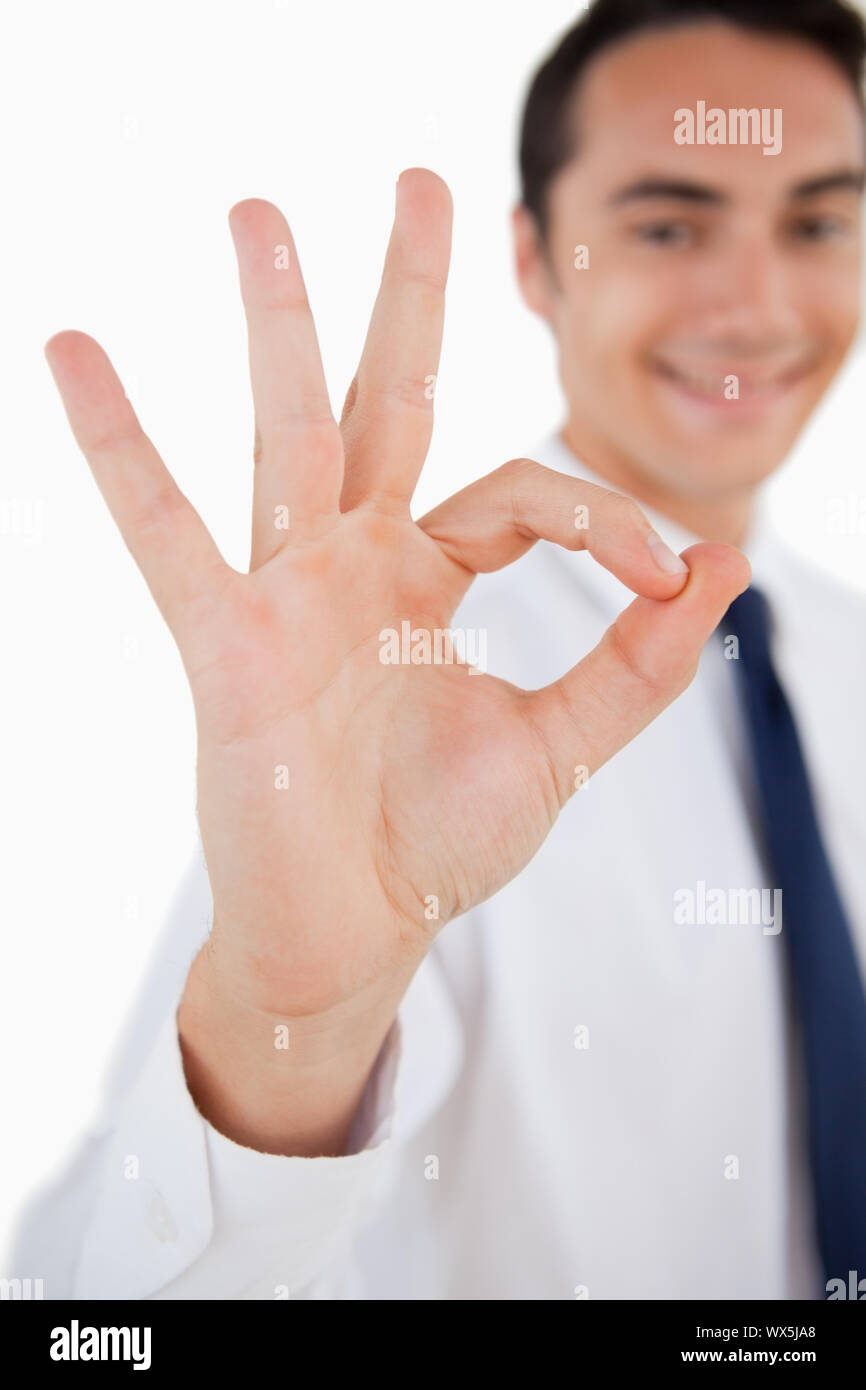 Close-up of a man approving against white background Stock Photo - Alamy