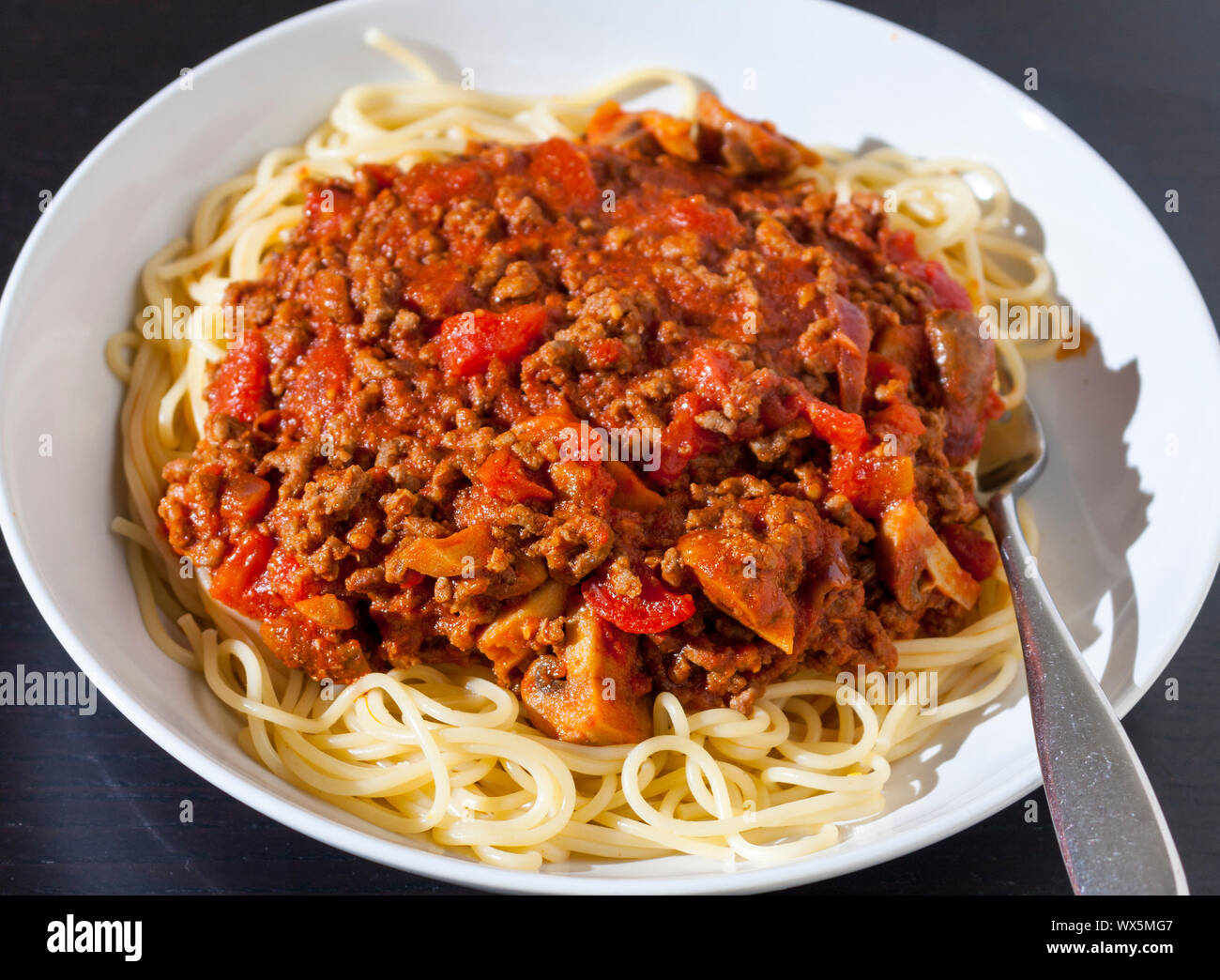 Home-made spaghetti bolognese in a white bowl Stock Photo - Alamy