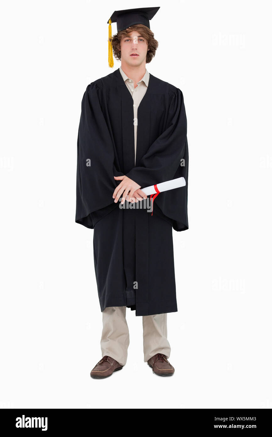 Student in graduate robe against white background Stock Photo - Alamy