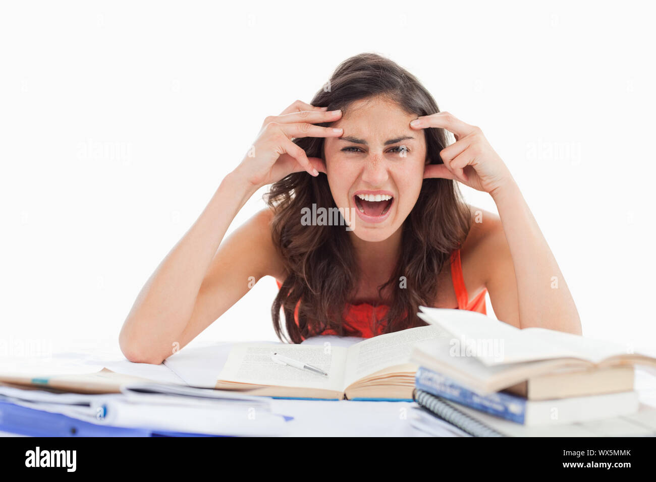 Student goes crazy doing her homework against white background Stock ...