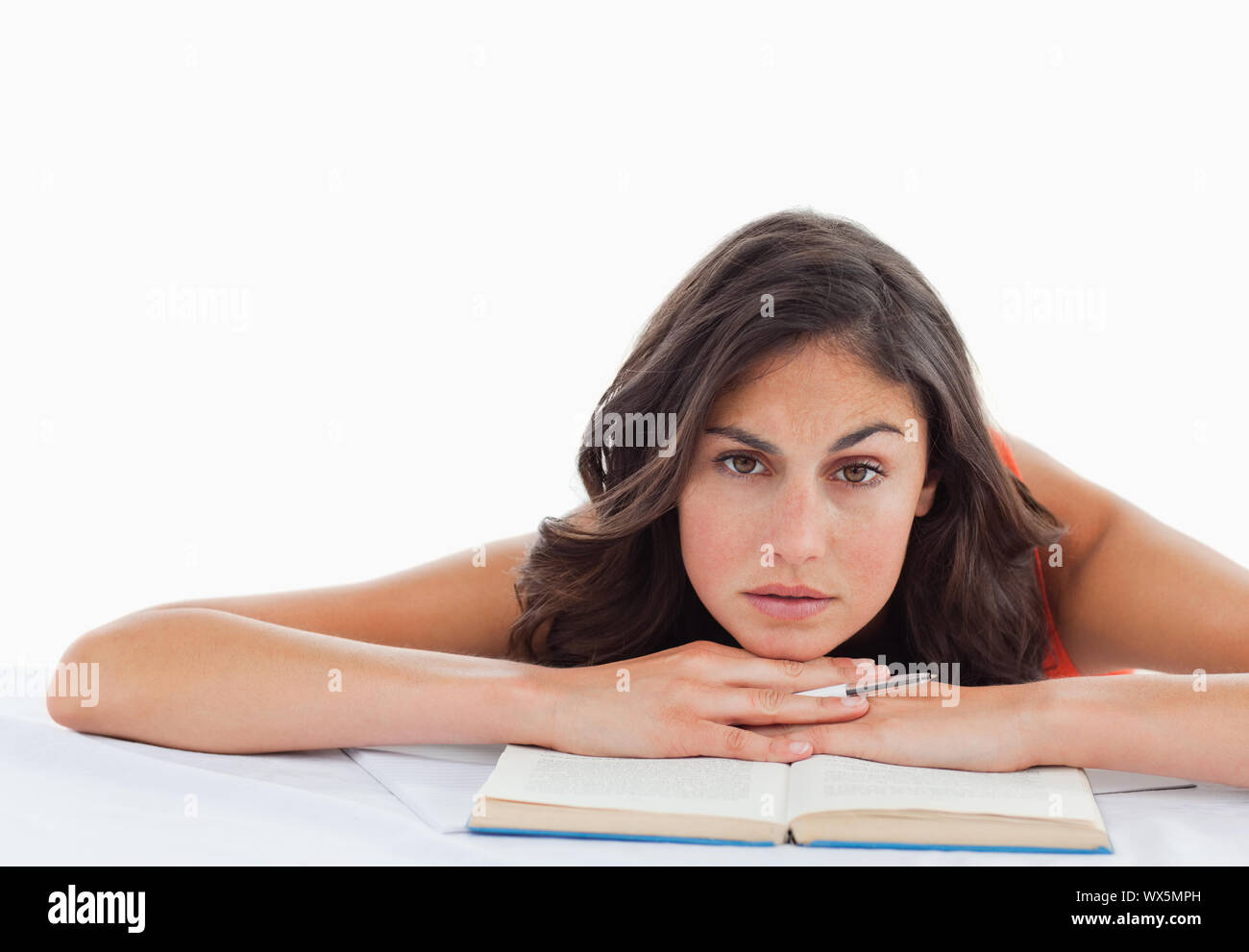 Frowning student head on her books against white background Stock Photo ...