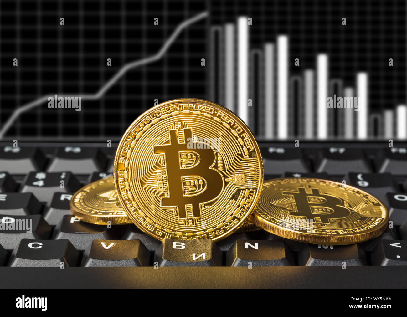 Bitcoins on computer and diagram - business background Stock Photo - Alamy