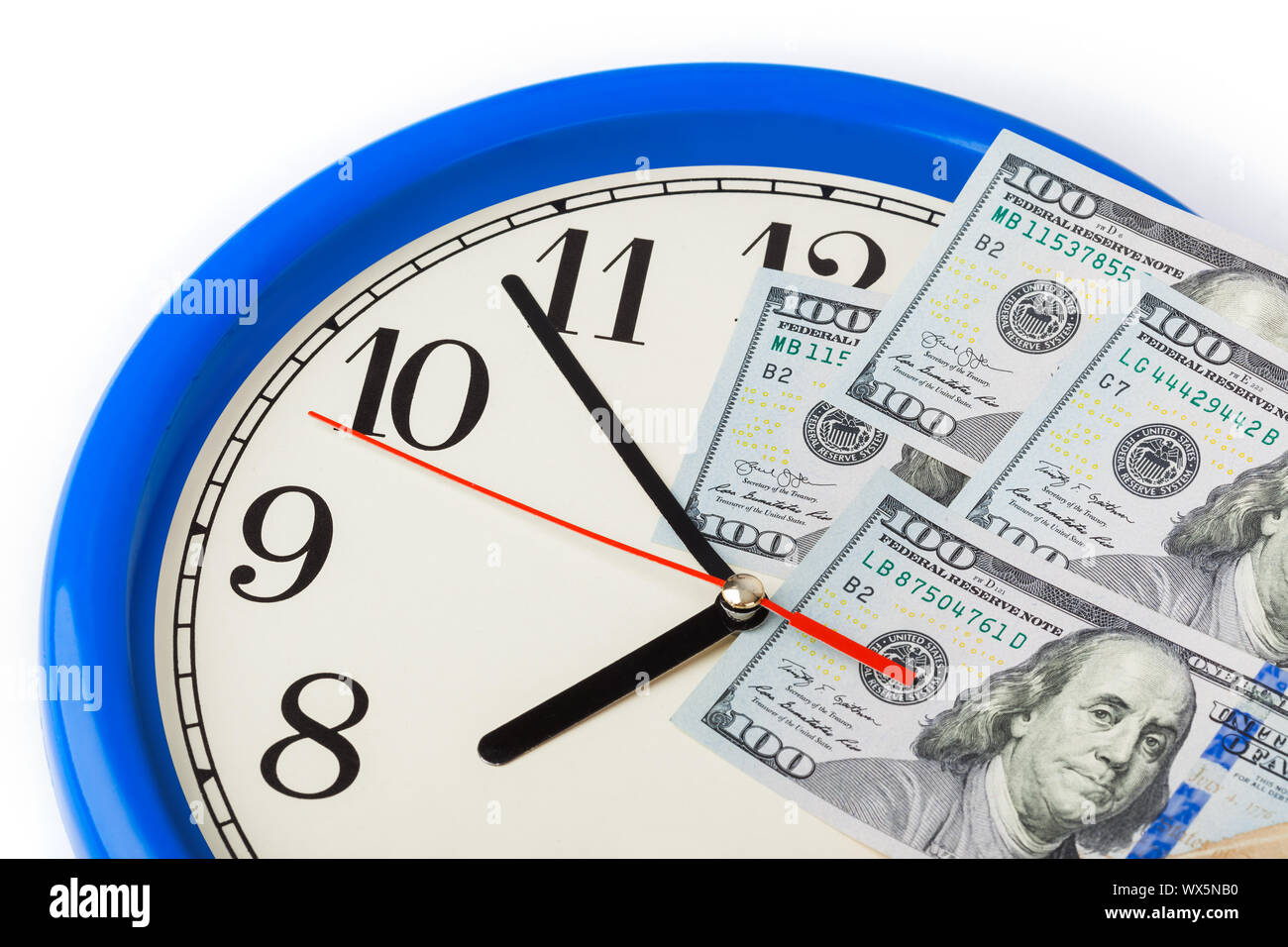 Clock and money - business concept Stock Photo - Alamy