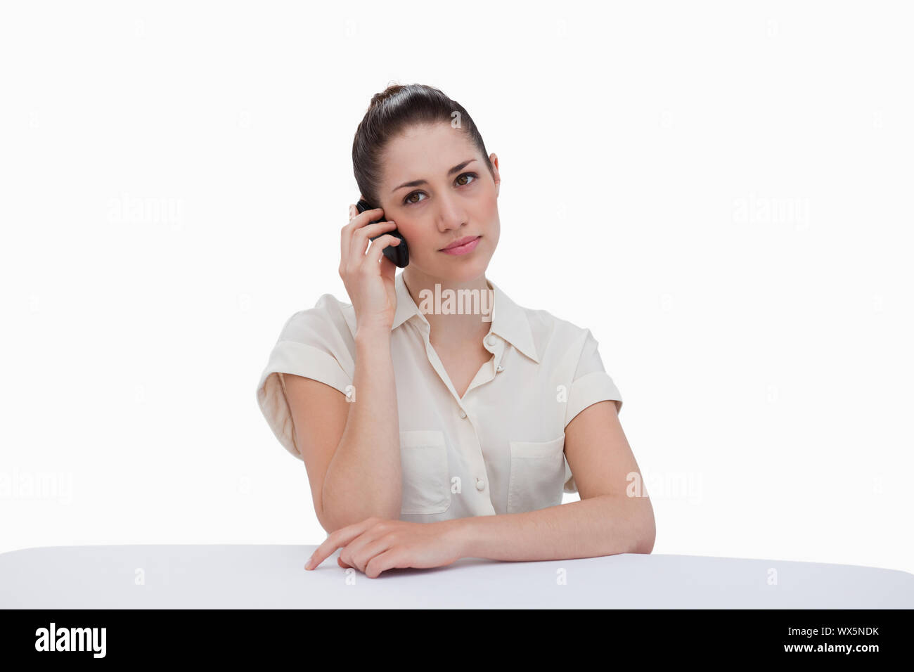 Businesswoman making a phone call against a white background Stock ...