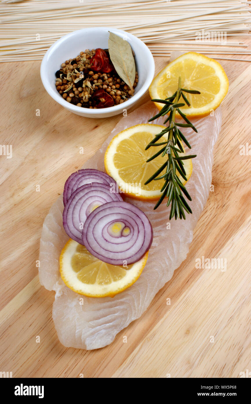 raw vietnamese river cobbler fillet on a timber board Stock Photo - Alamy