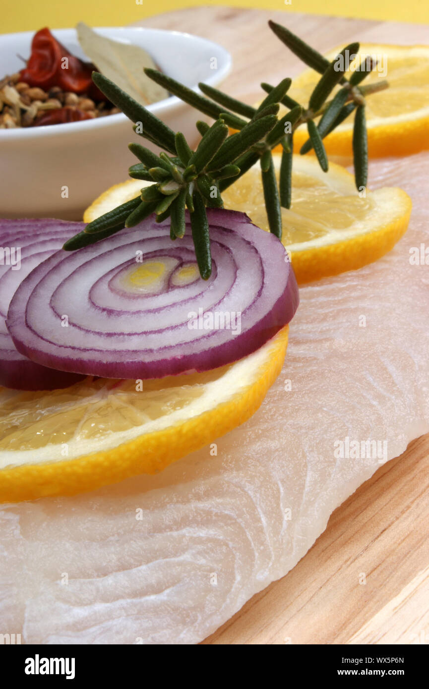 raw vietnamese river cobbler fillet on a timber board Stock Photo - Alamy