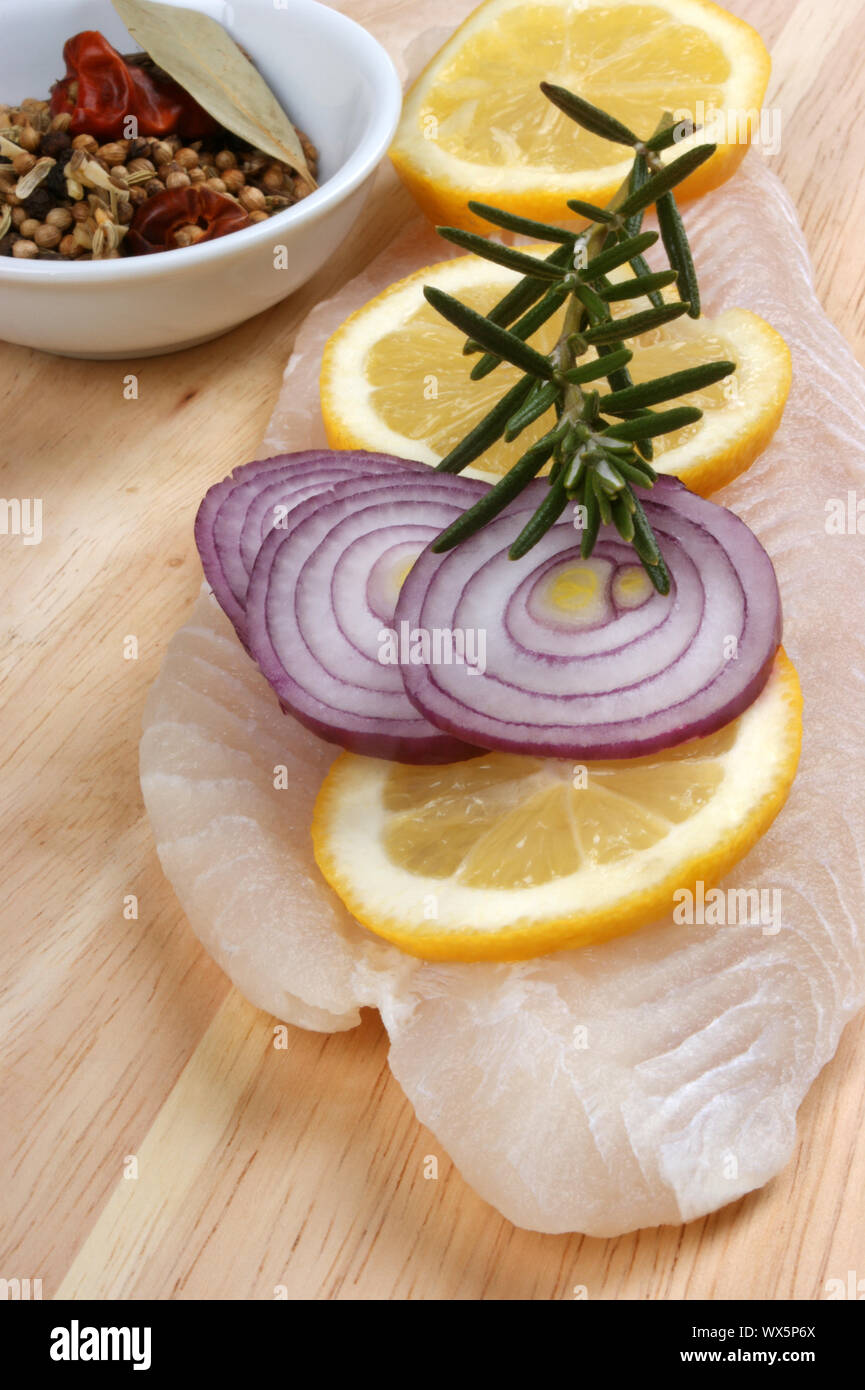 raw vietnamese river cobbler fillet on a timber board Stock Photo - Alamy