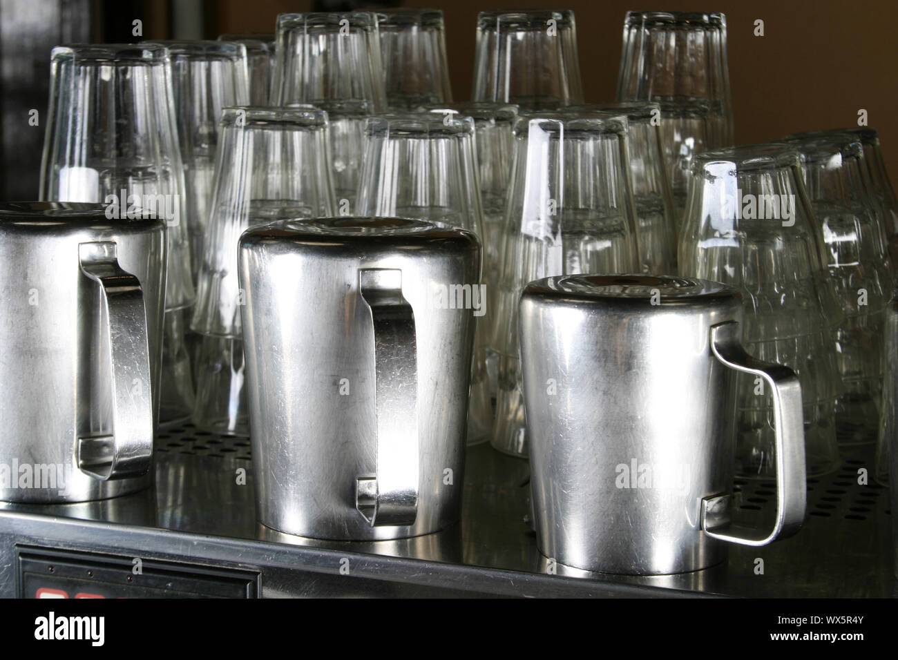 Milk Pitchers for steaming milk for cafe lattes Stock Photo - Alamy