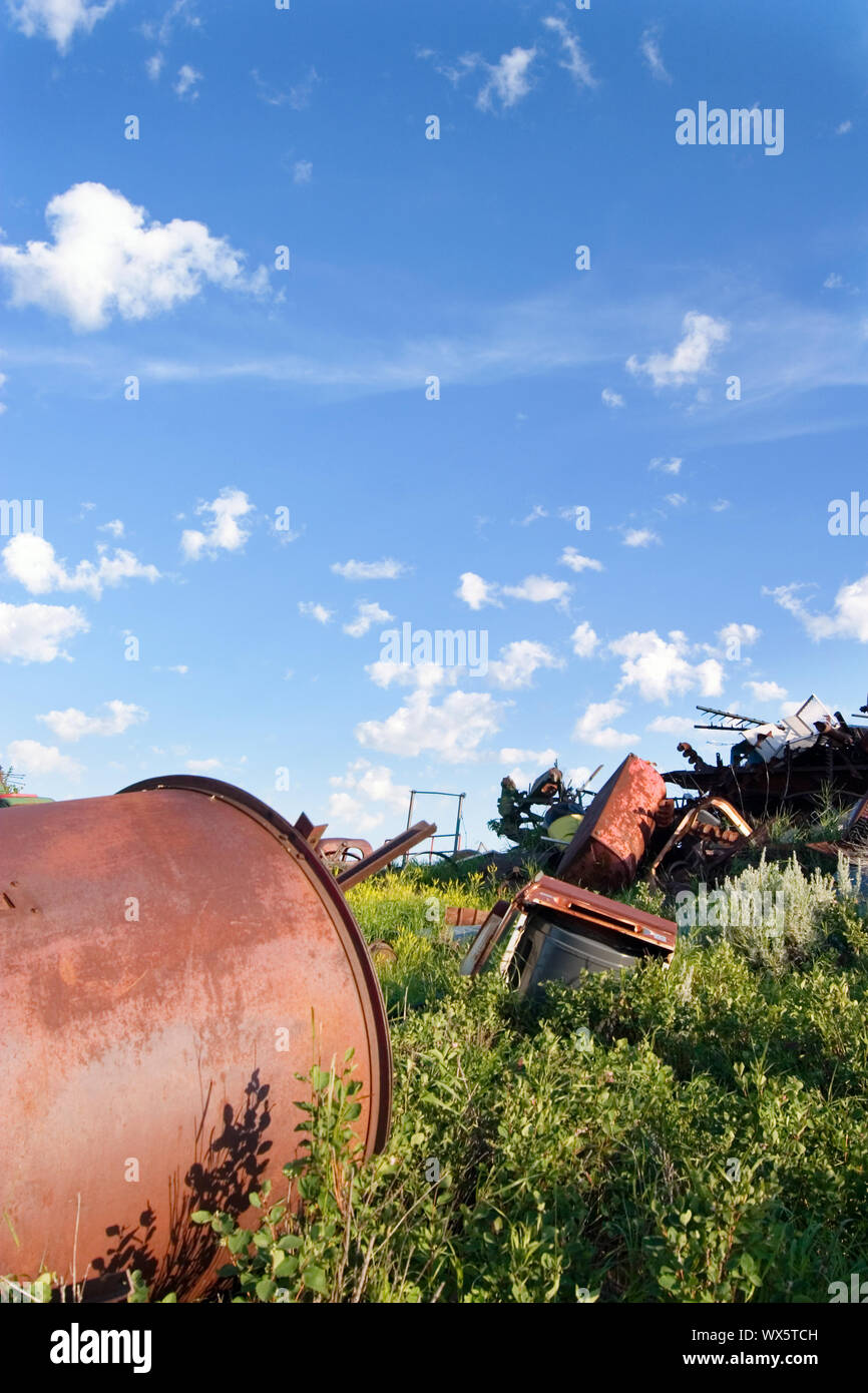 A pile of old rusting metal and old equipment on the prairie Stock ...