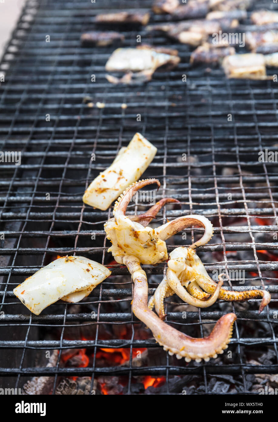 octopus is preparing on grill Stock Photo - Alamy