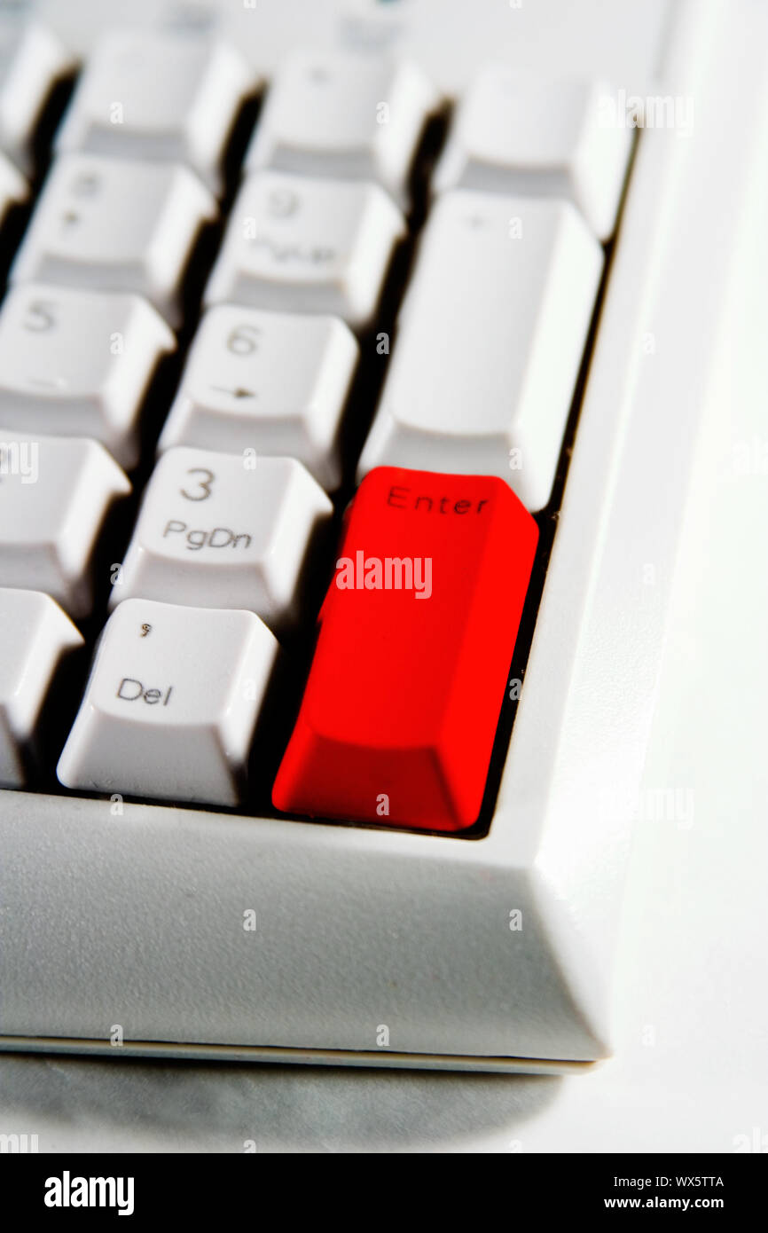 Desktop Computer Keyboard with enter key in red Stock Photo - Alamy