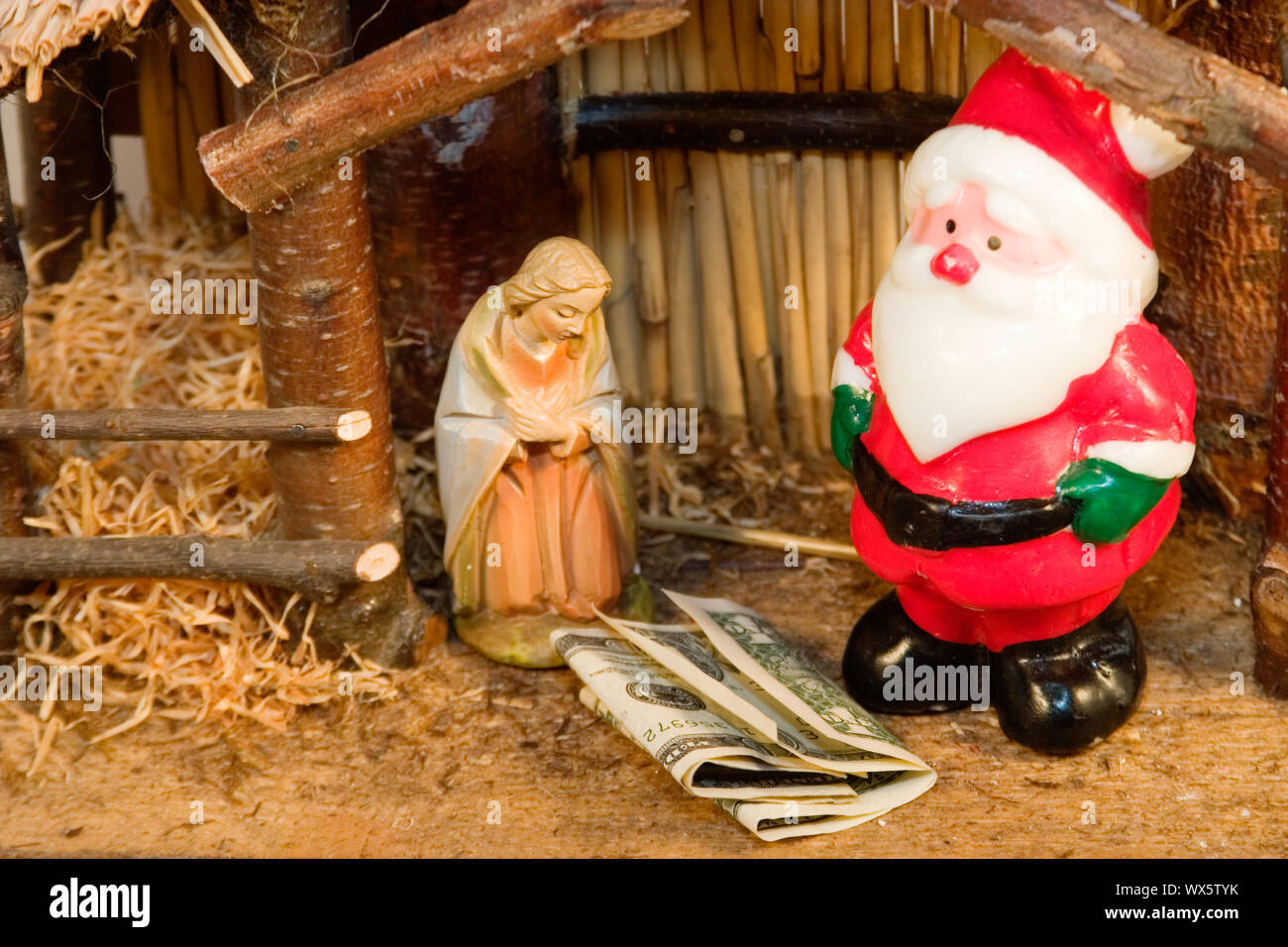 Commercialism vs Christmas Mary Santa and Christ Stock Photo - Alamy