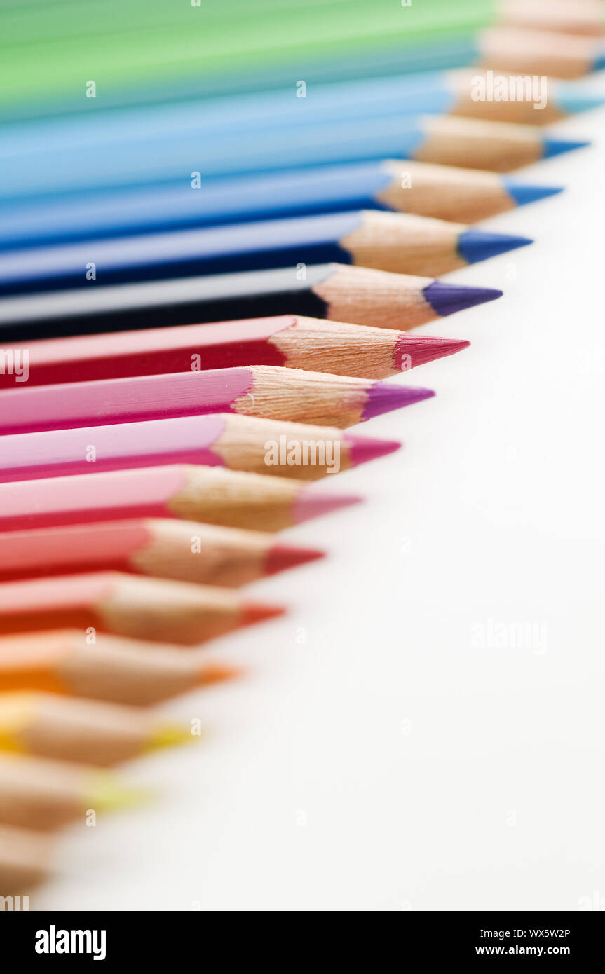 colorful pencils in a row vertical Stock Photo - Alamy