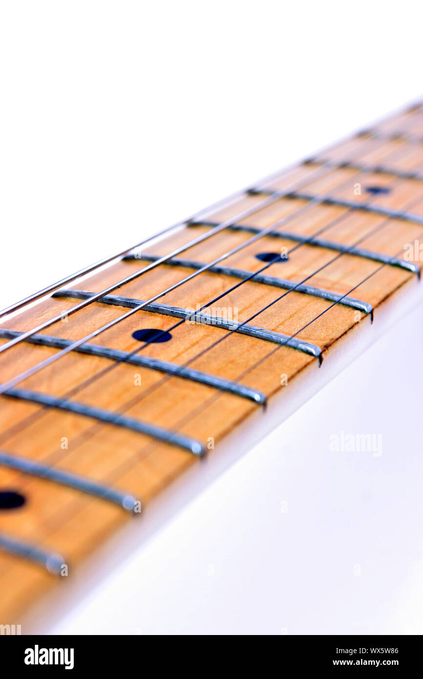 Closeup of a guitar fretboard on white background Stock Photo - Alamy