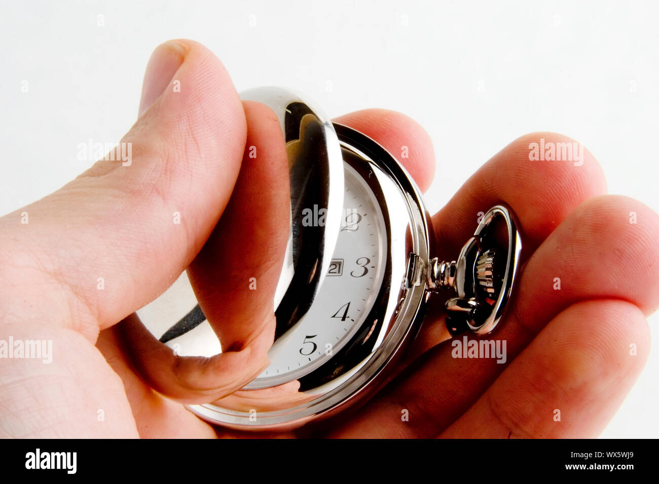 A male hand holding a fancy pocket watch Stock Photo - Alamy