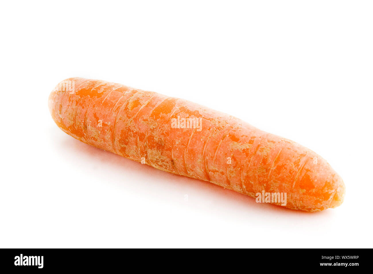 A single carrot on a white background Stock Photo - Alamy