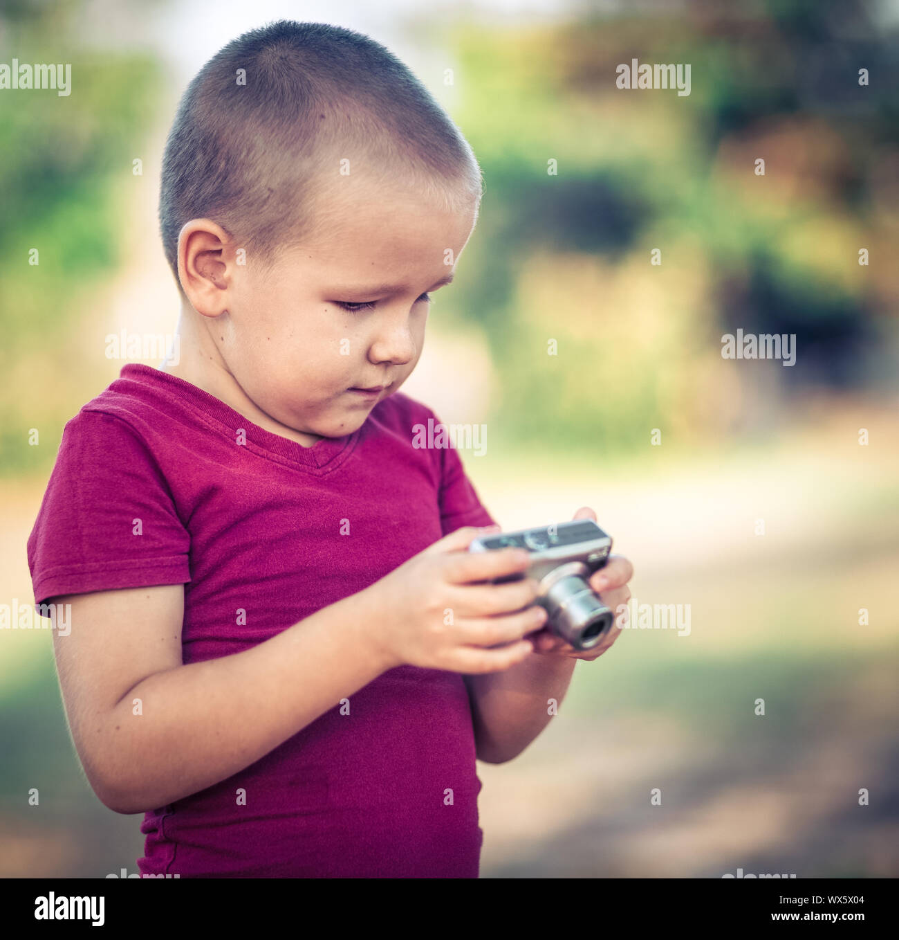 Little cute boy with camera Stock Photo - Alamy