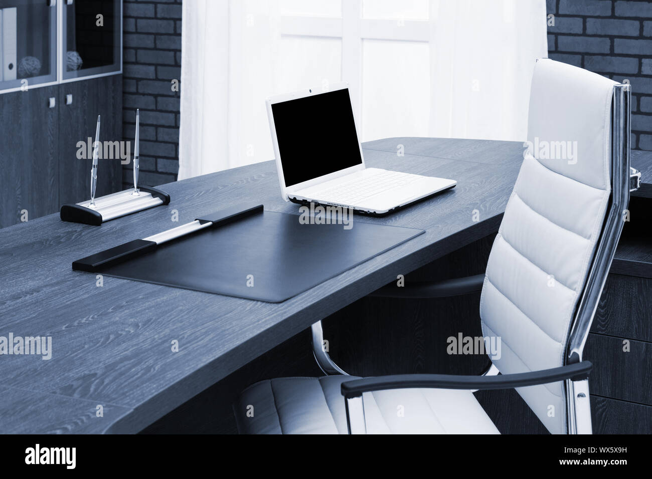 laptop on desk in office Stock Photo - Alamy